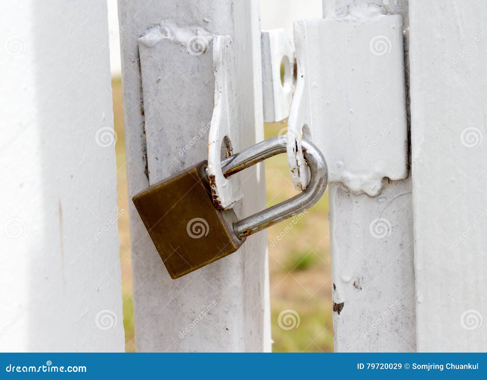 Key Lock at White Fence for Protection Asset. Stock Image - Image of ...