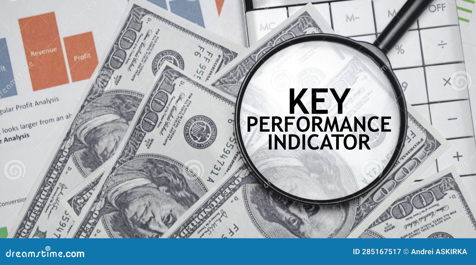 KEY PERFORMANCE INDICATOR Words on Magnifier Glass with Dollars and ...