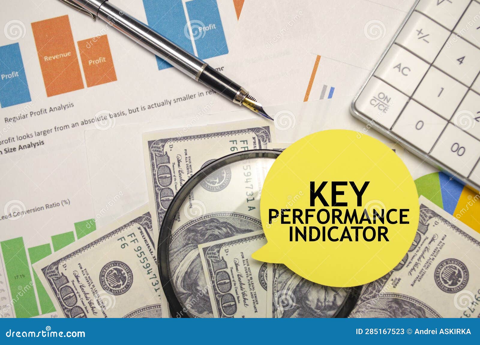 KEY PERFORMANCE INDICATOR Words on Yellow Sticker with Dollars with ...