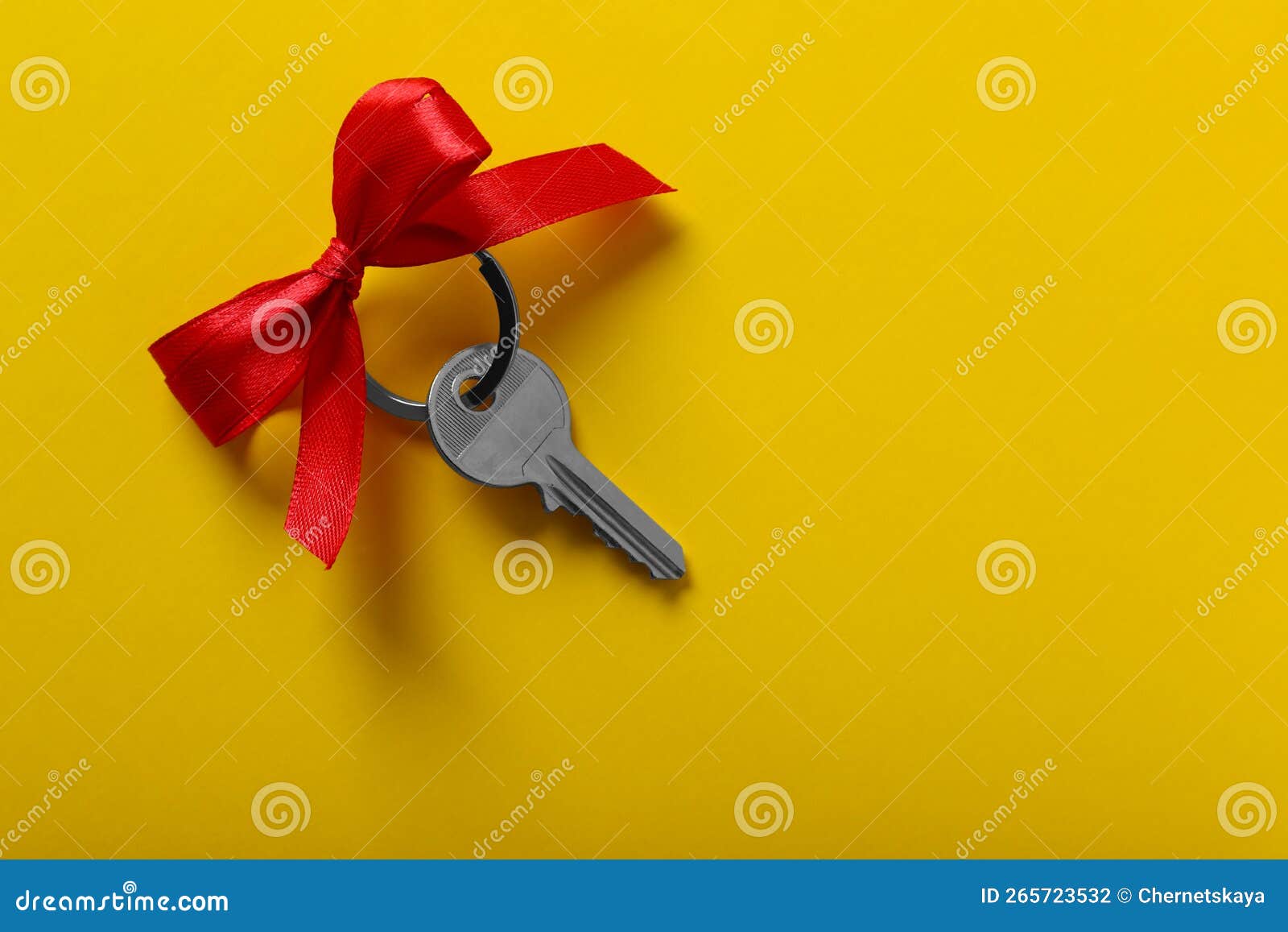 Key with Red Bow on Yellow Background, Top View. Space for Text ...