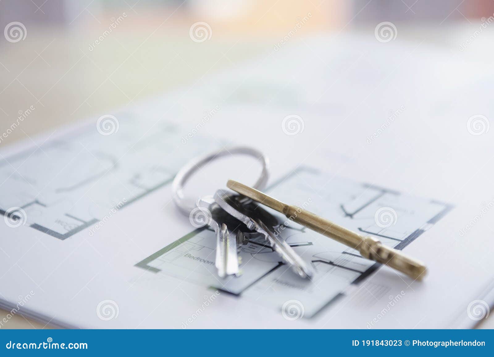 Key Ring with Three Keys Lying on Architectural Blueprints Close-up ...