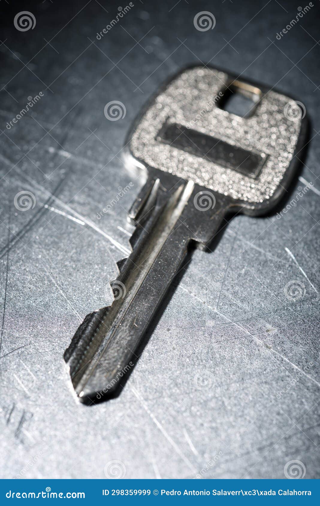 Key on a Scratched Metal Surface Stock Image - Image of selective ...