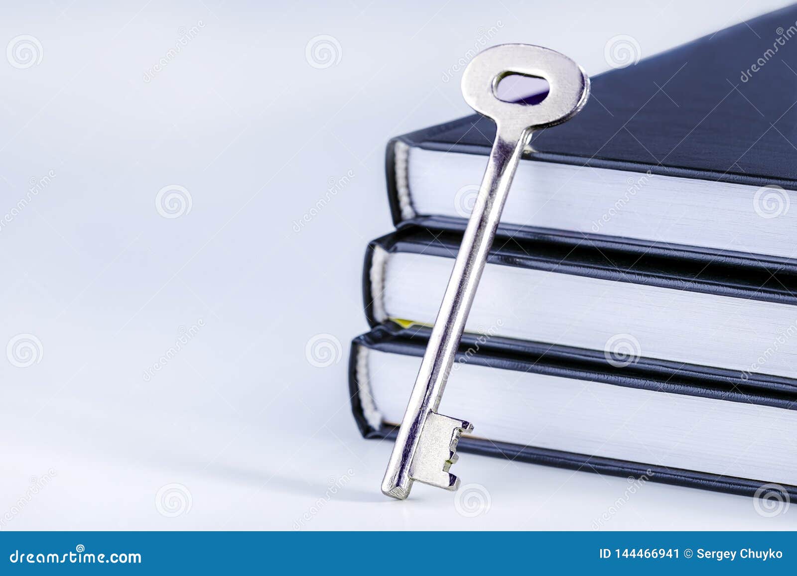 Key To Knowledge. Knowledge Concept with Books and Key with Copy Space ...