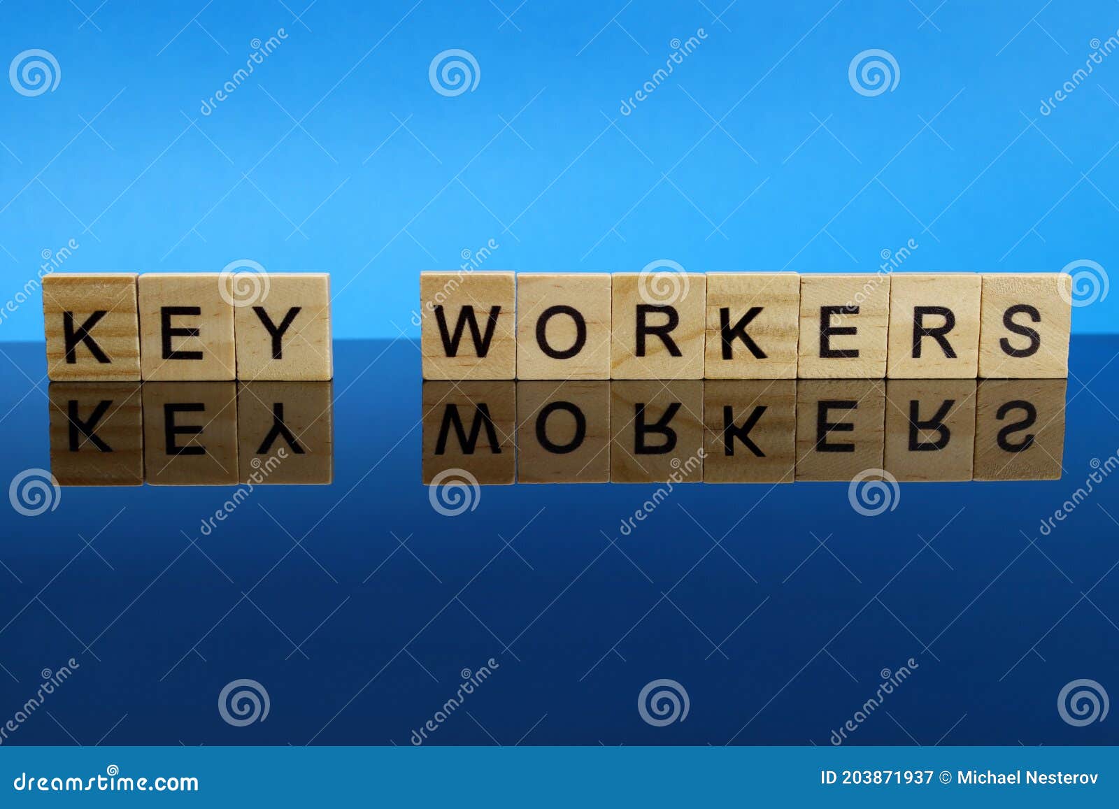 Key Workers, the Words Made of Wooden Letters on a Mirror Surface Stock ...