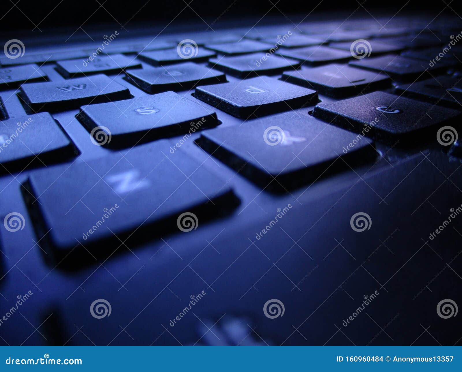 Close Up of Low Profile Keyboard Shot in Dark with Light from Computer ...