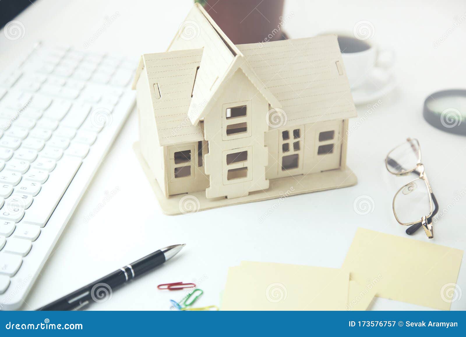 Keyboard with House Model and Stationary on Table Stock Image - Image ...