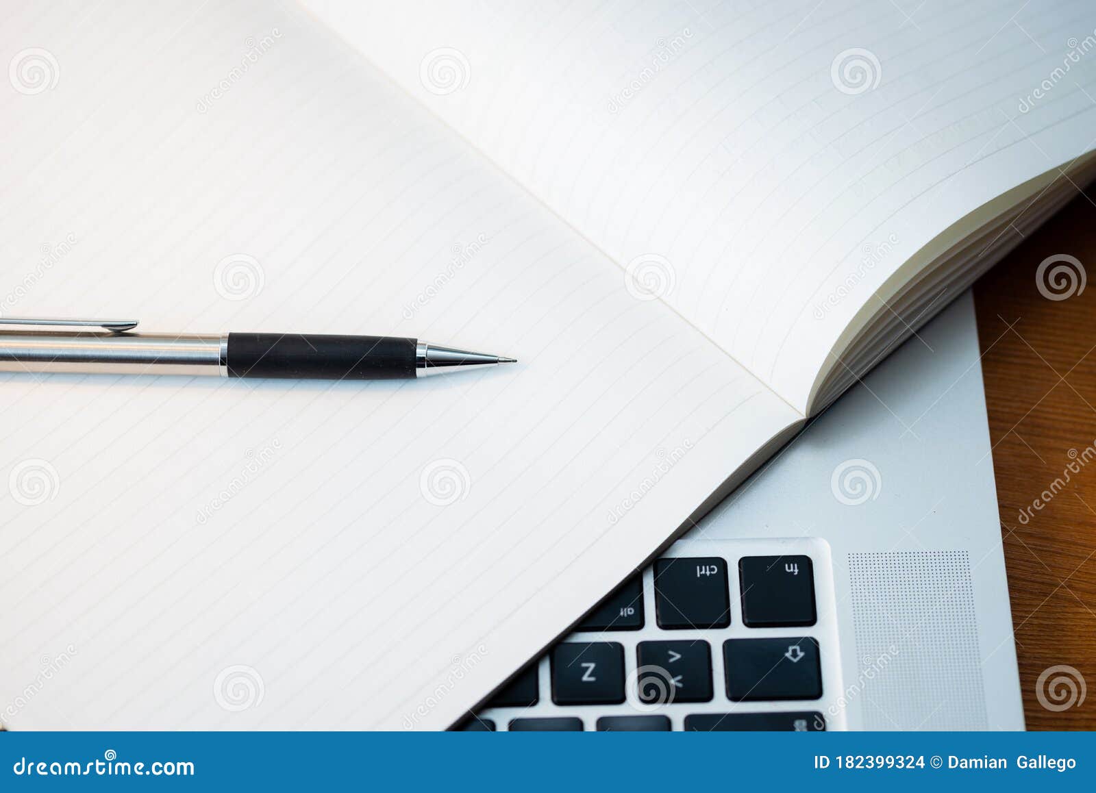 Keyboard of a Laptop from Above with a Notepad and a Pen Stock Photo ...