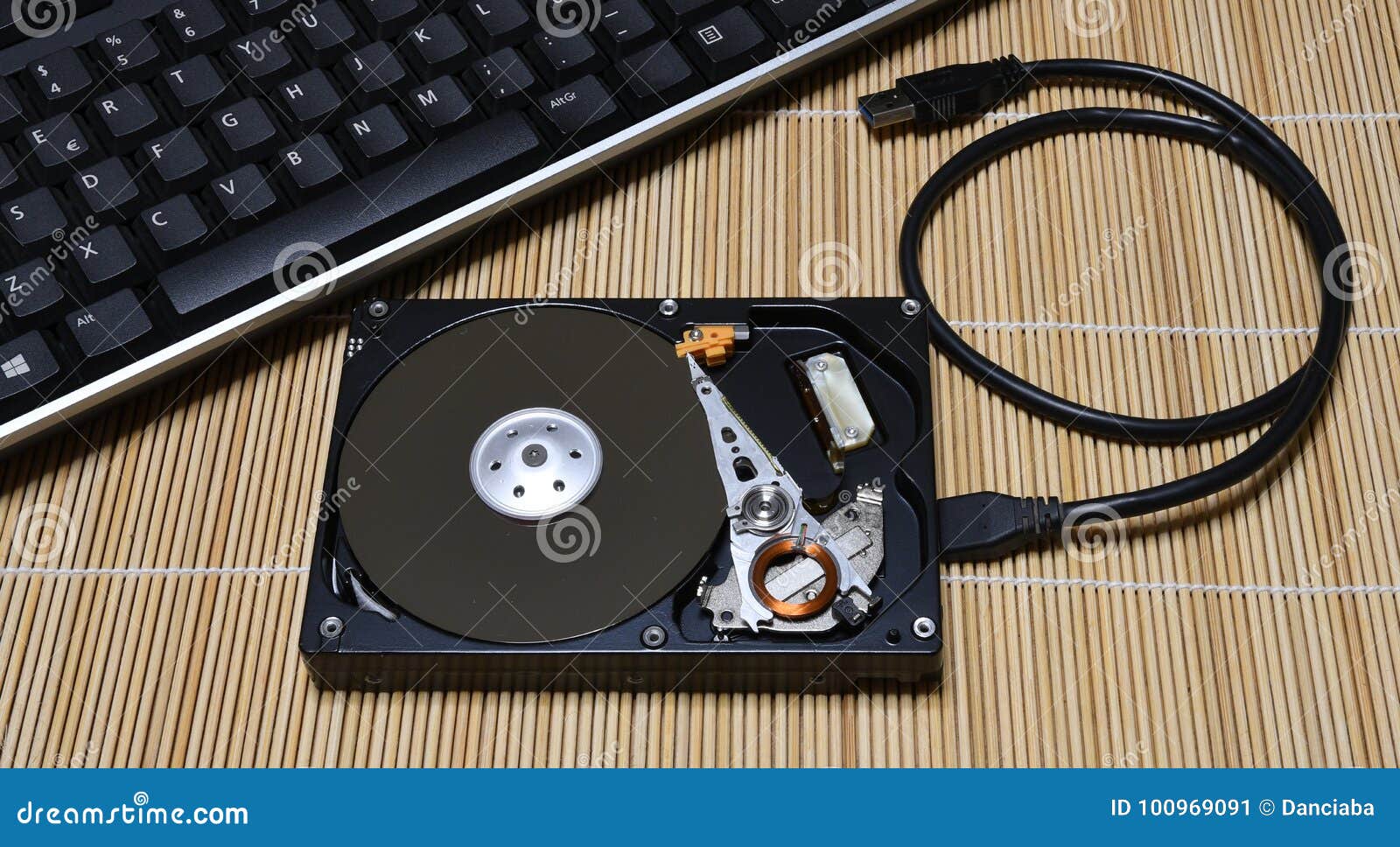 Keyboard and Open Hard Disk Drive on Wood Background Editorial Photo ...