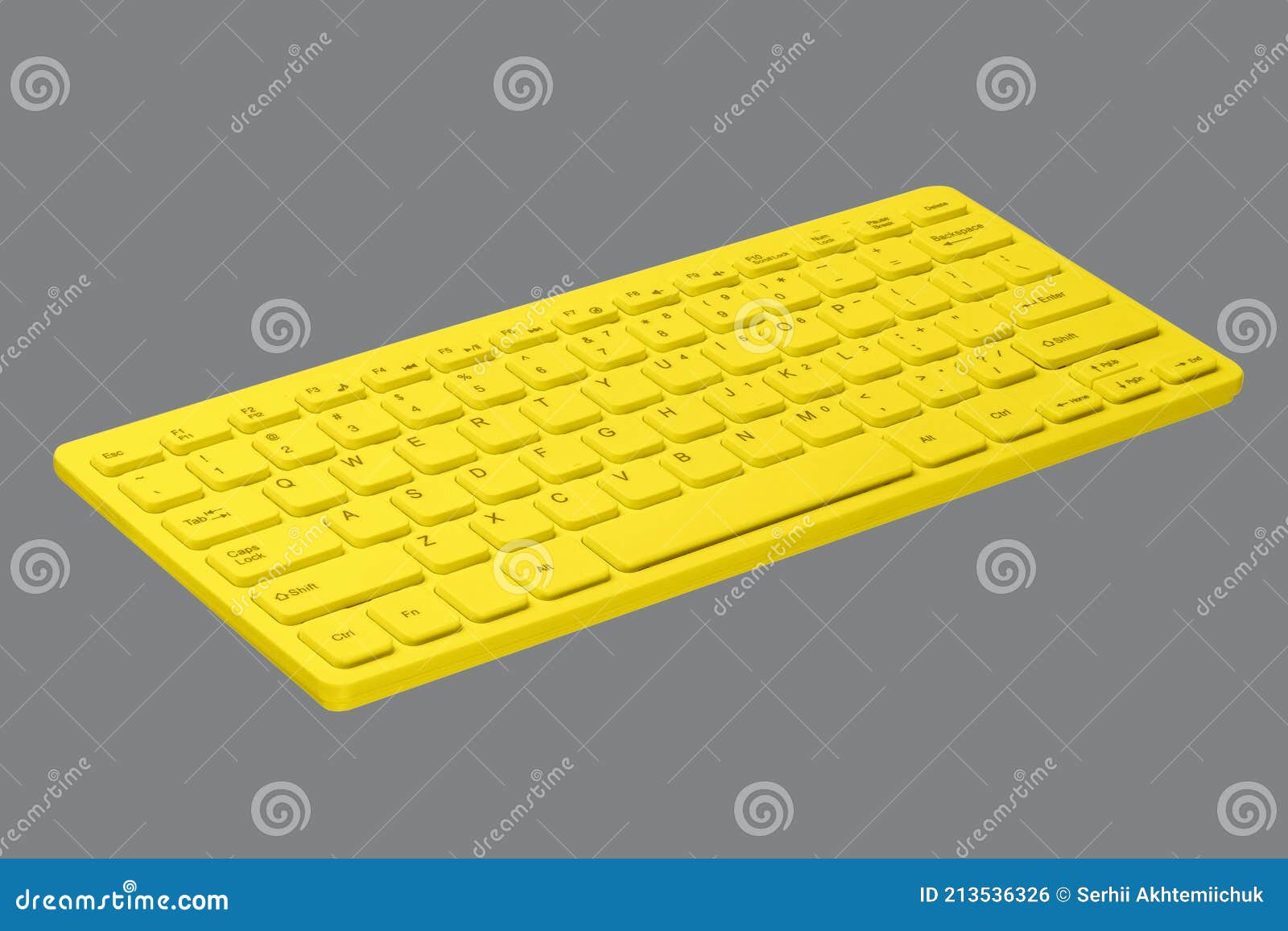 . the Keyboard is Painted Yellow on a Gray Background in Accordance ...