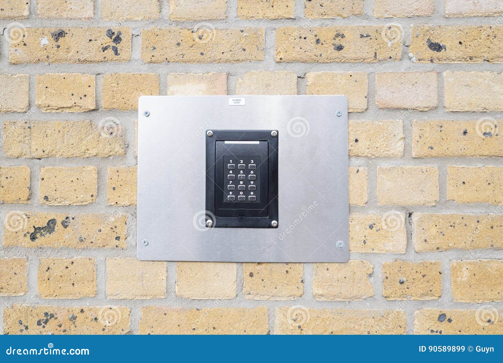 Keypad on a brick wall stock image. Image of modern, button - 90589899
