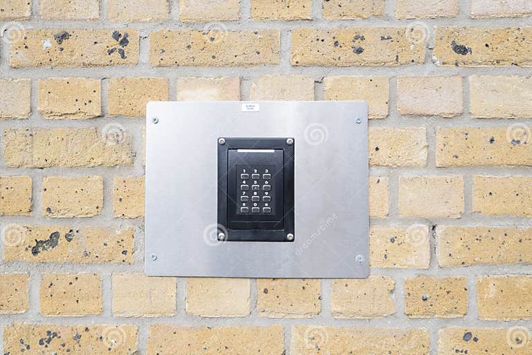 Keypad on a brick wall stock image. Image of modern, button - 90589899