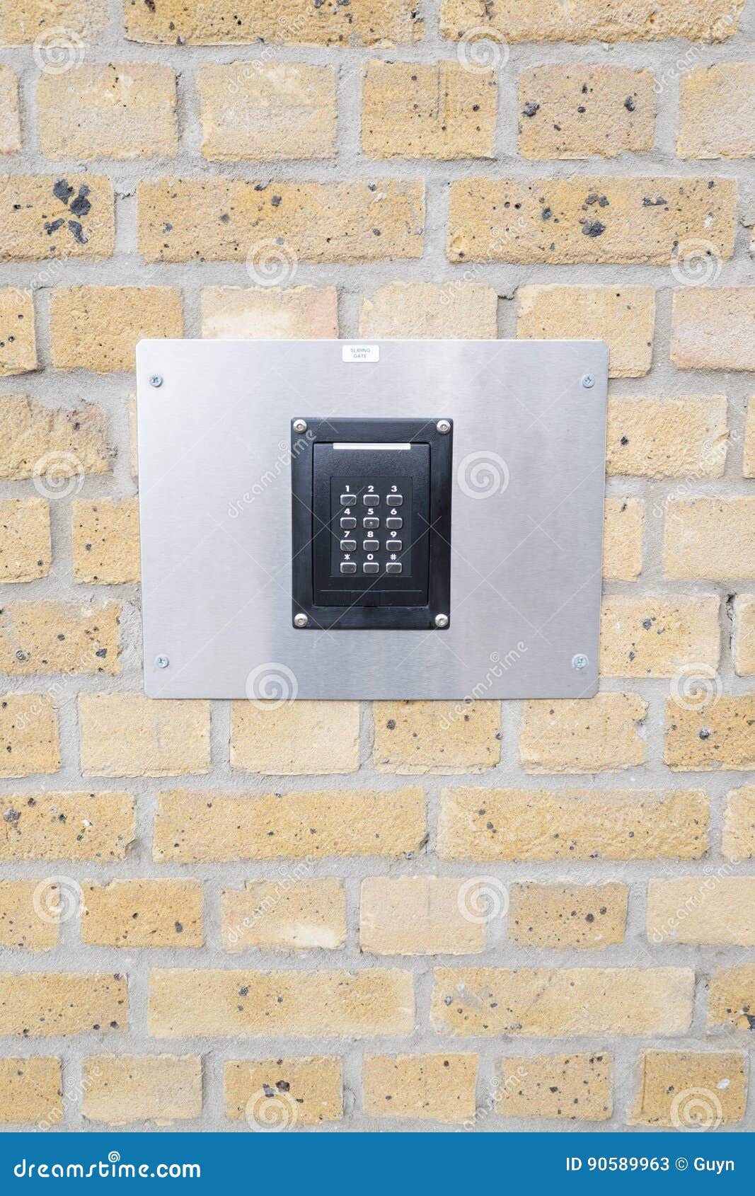 Keypad on a brick wall stock image. Image of yellow, electric - 90589963