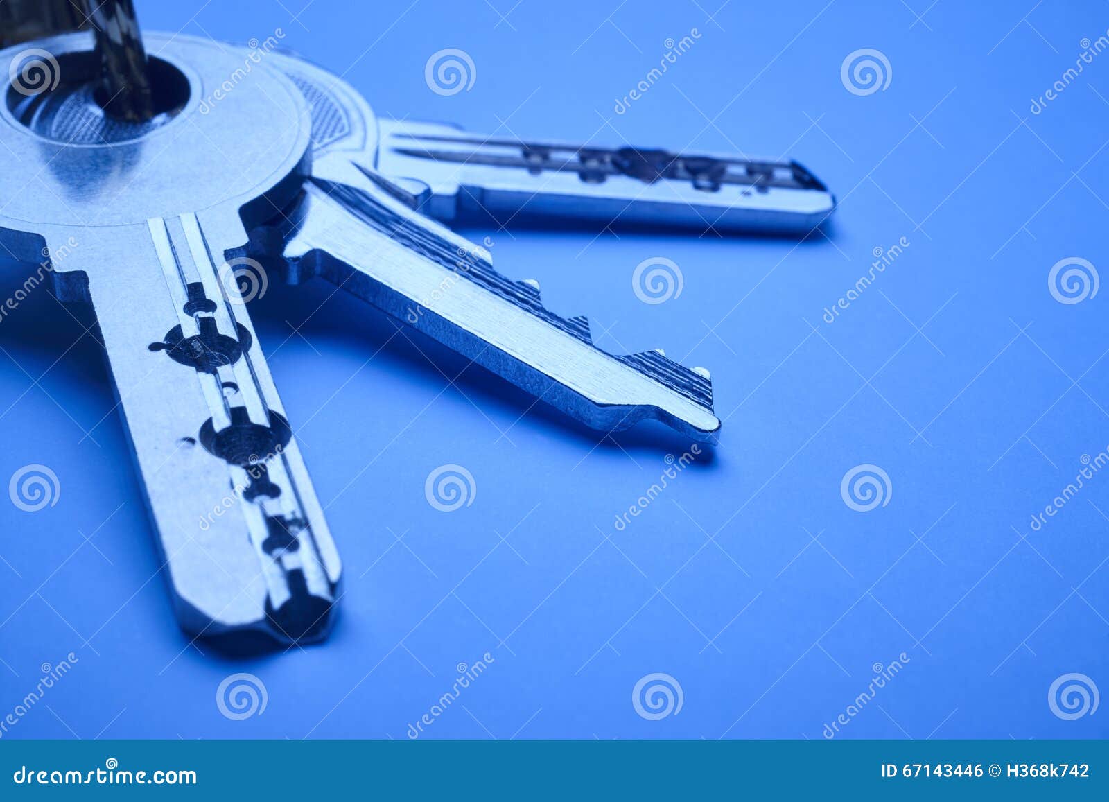 Keyring with Keys in Blue Tone Over an Empty Background Stock Photo ...