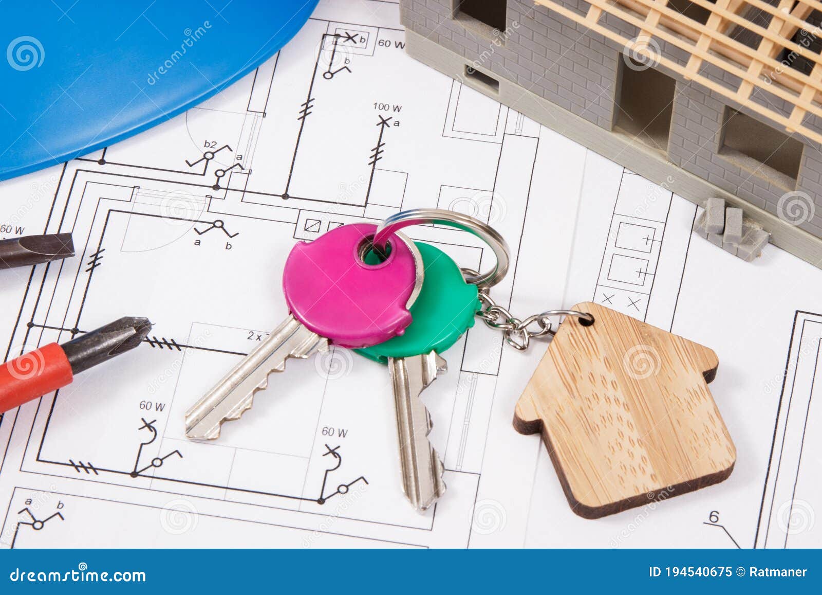 Keys with Home Shape and Small House Under Construction with Electrical ...