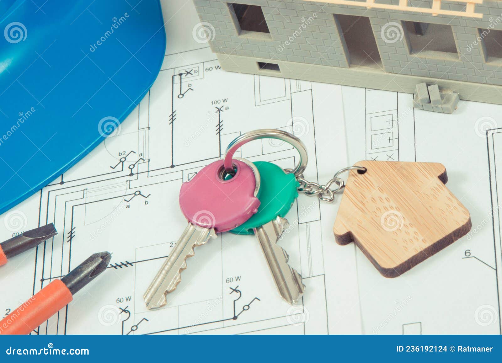 Keys with Home Shape and Small House Under Construction with Electrical ...