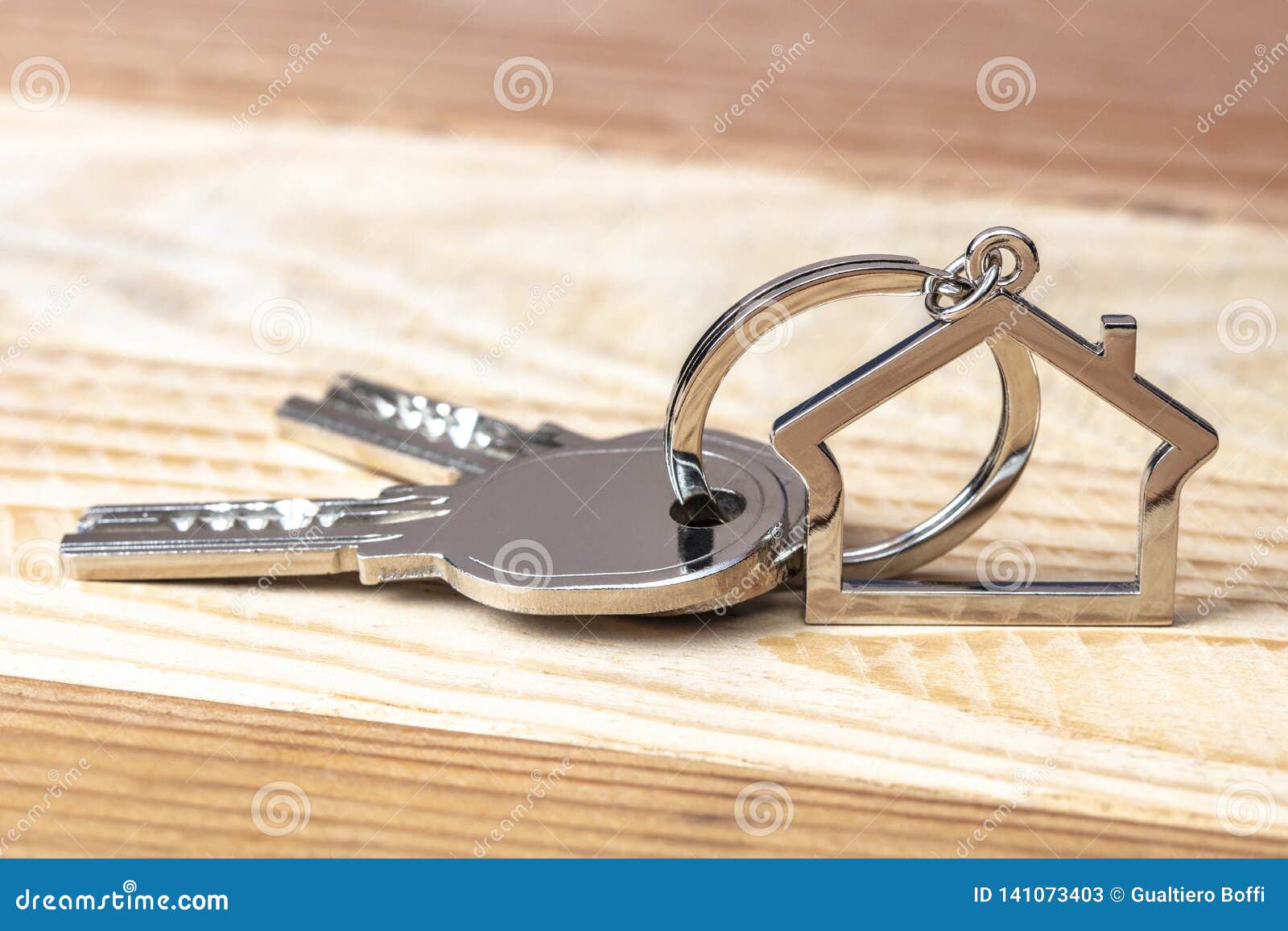 Keys and keychains on wood stock image. Image of ring - 141073403