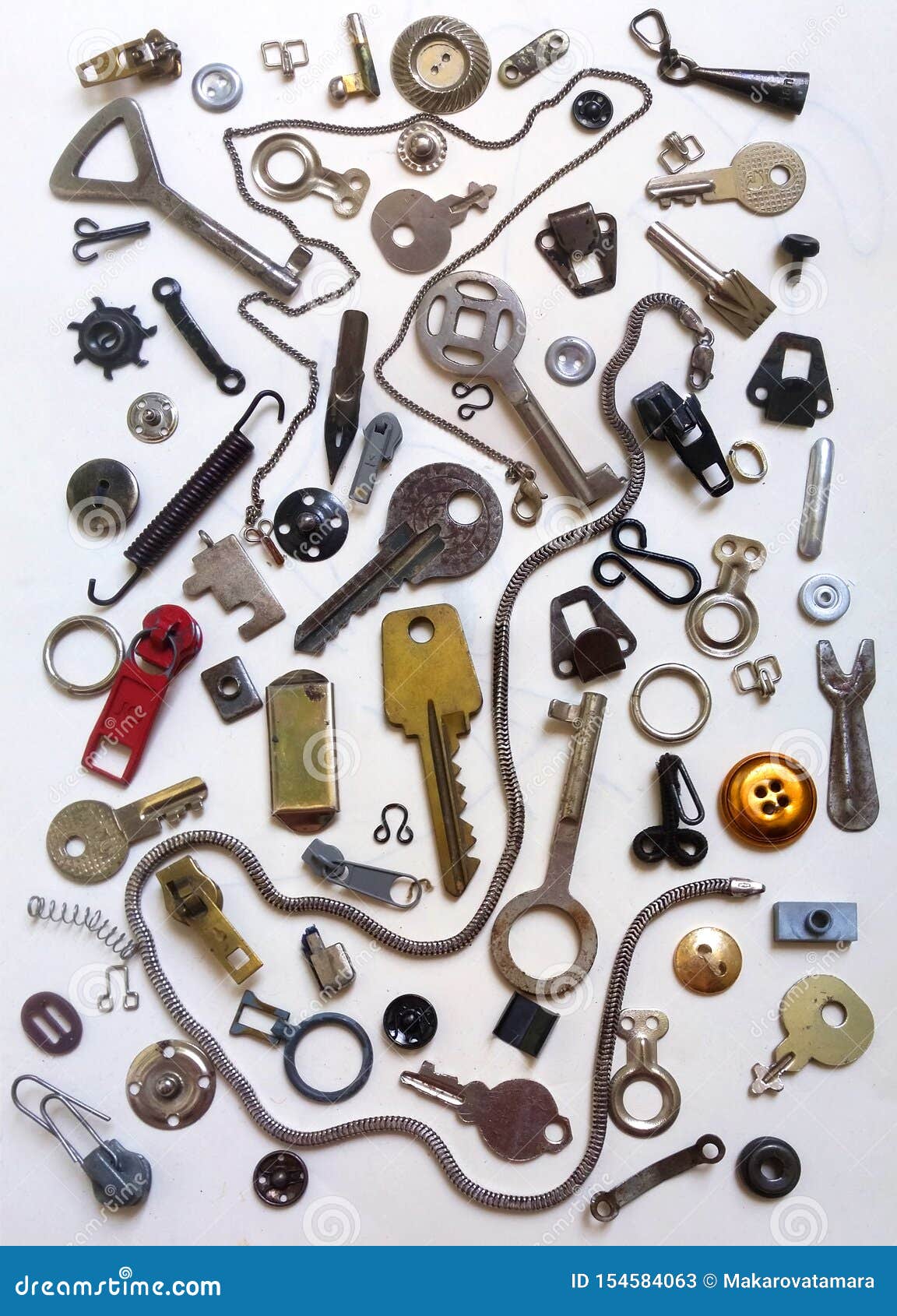 Keys, Locks, Hooks, Chains and Other Small Metallic Stuff on the White ...