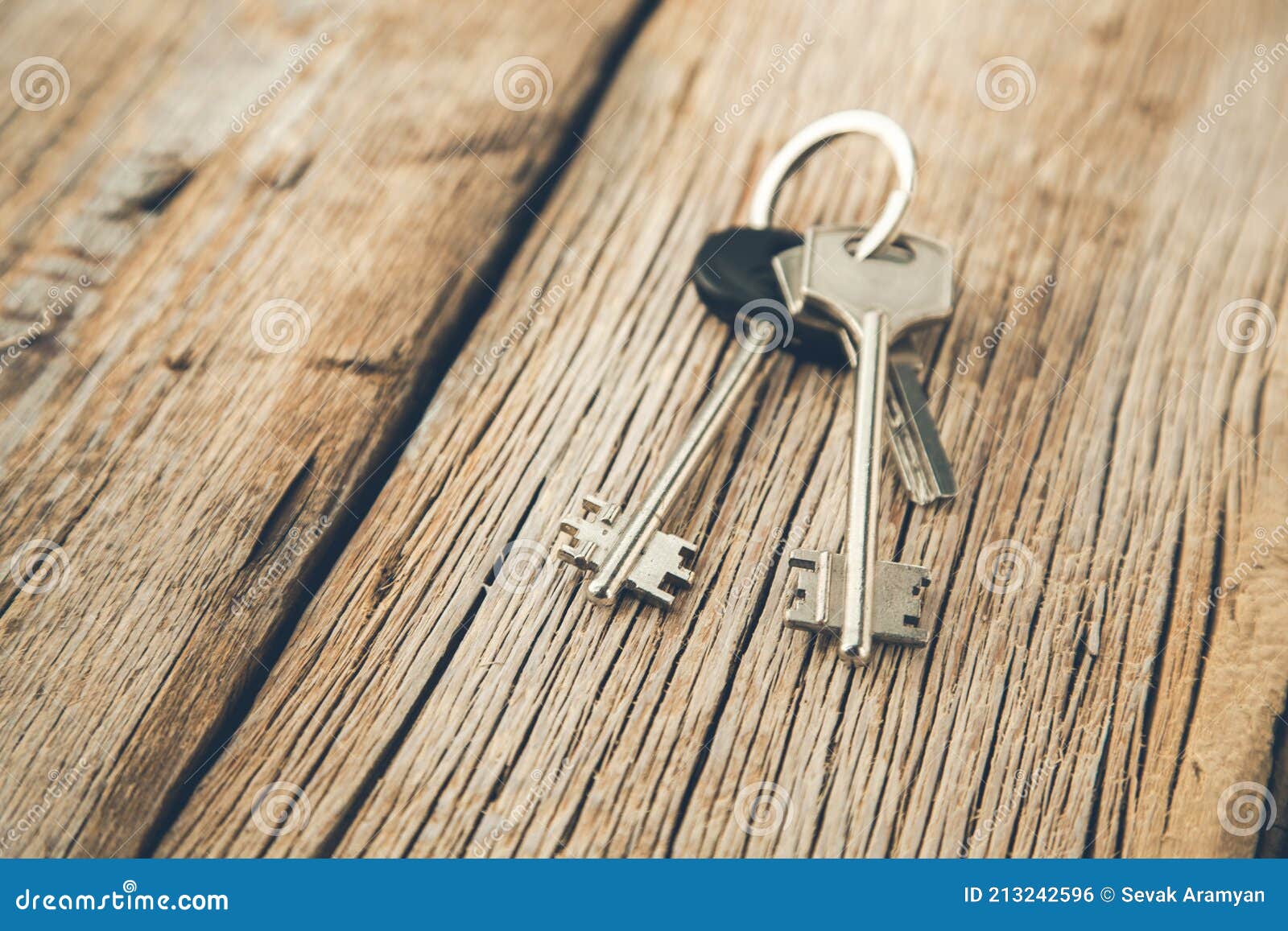 Keys on the wooden desk. stock photo. Image of business - 213242596