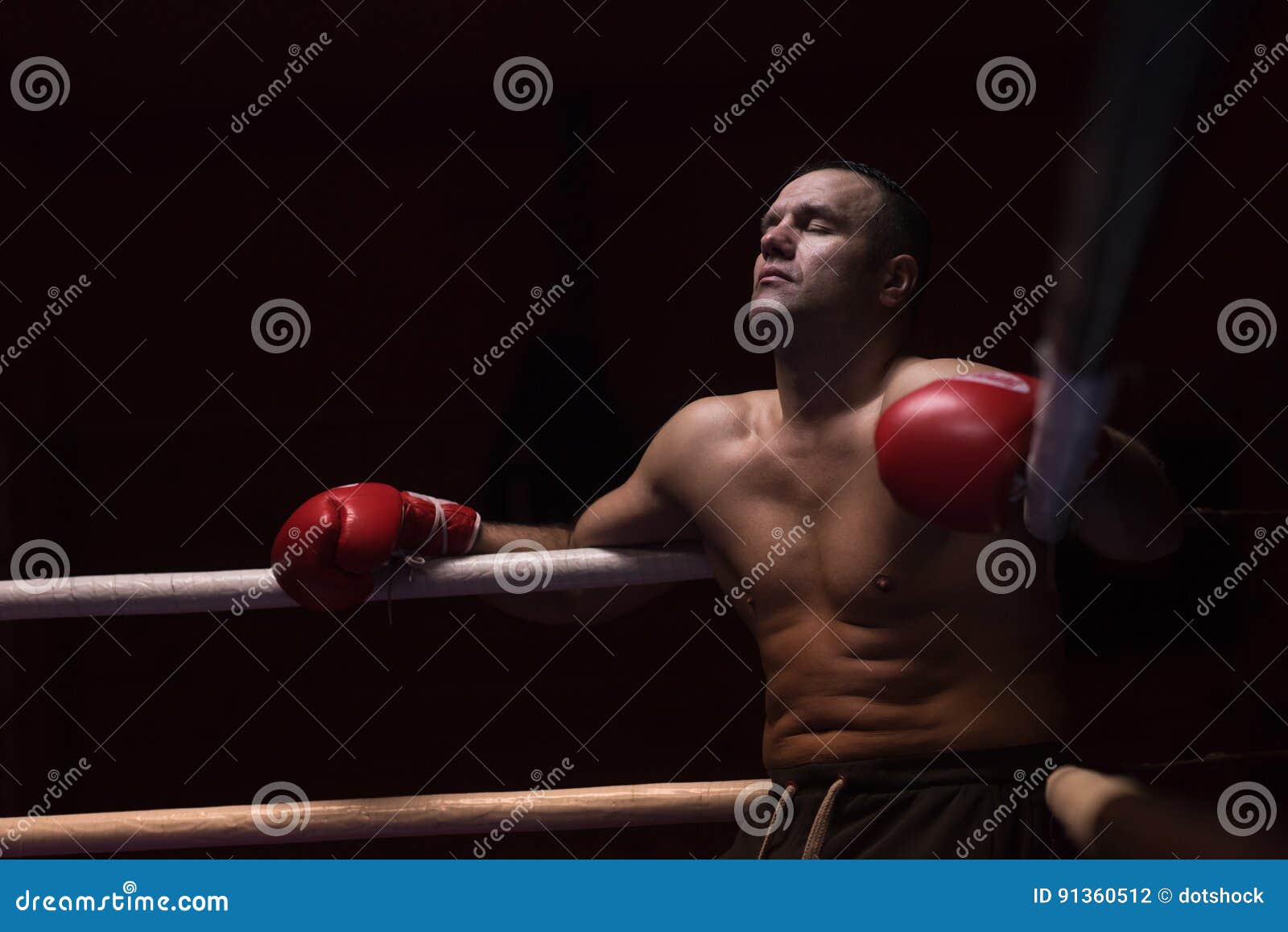 Kick Boxer Resting on the Ropes in the Corner Stock Photo - Image of ...