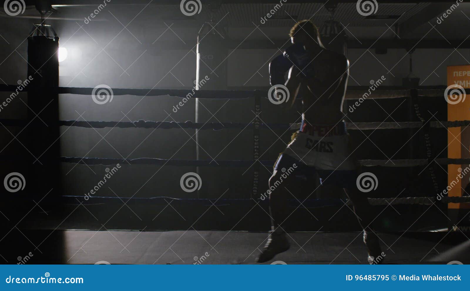 Kickbox Fighter Shadow Boxing in the Ring. the Athlete Fights with His ...