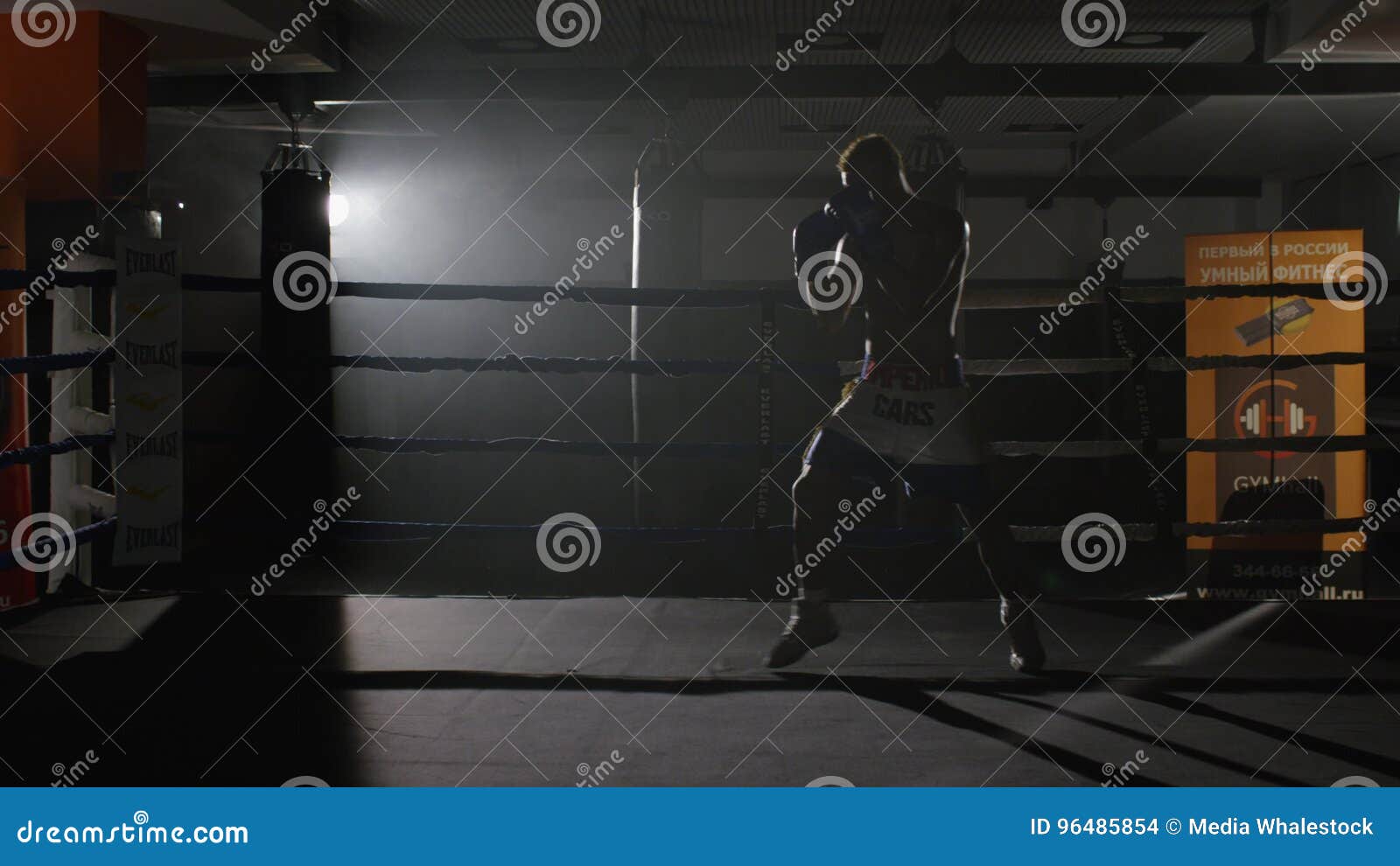 Kickbox Fighter Shadow Boxing in the Ring. the Athlete Fights with His ...