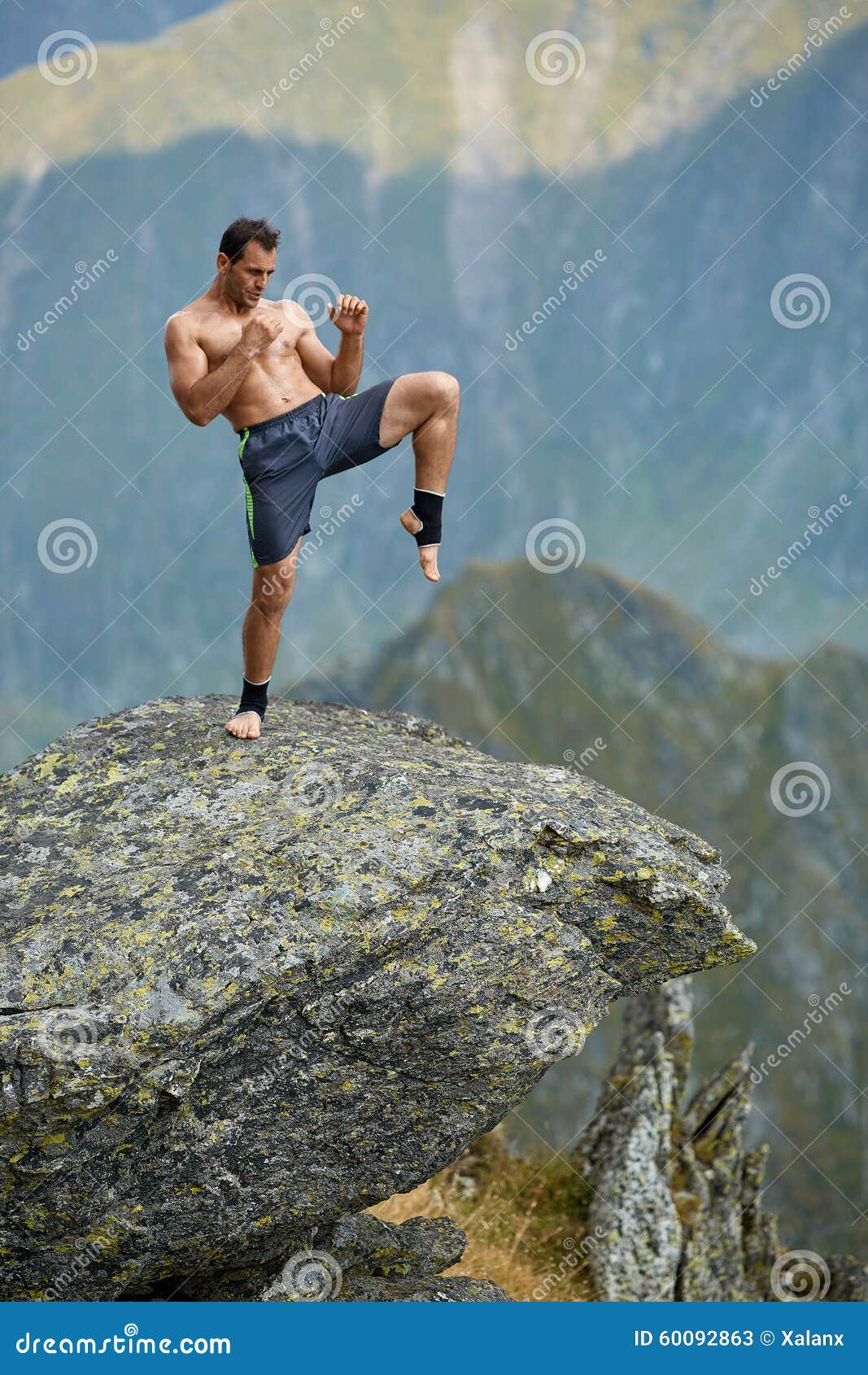 Kickboxer or Muay Thai Fighter Training on a Mountain Cliff Stock Image ...