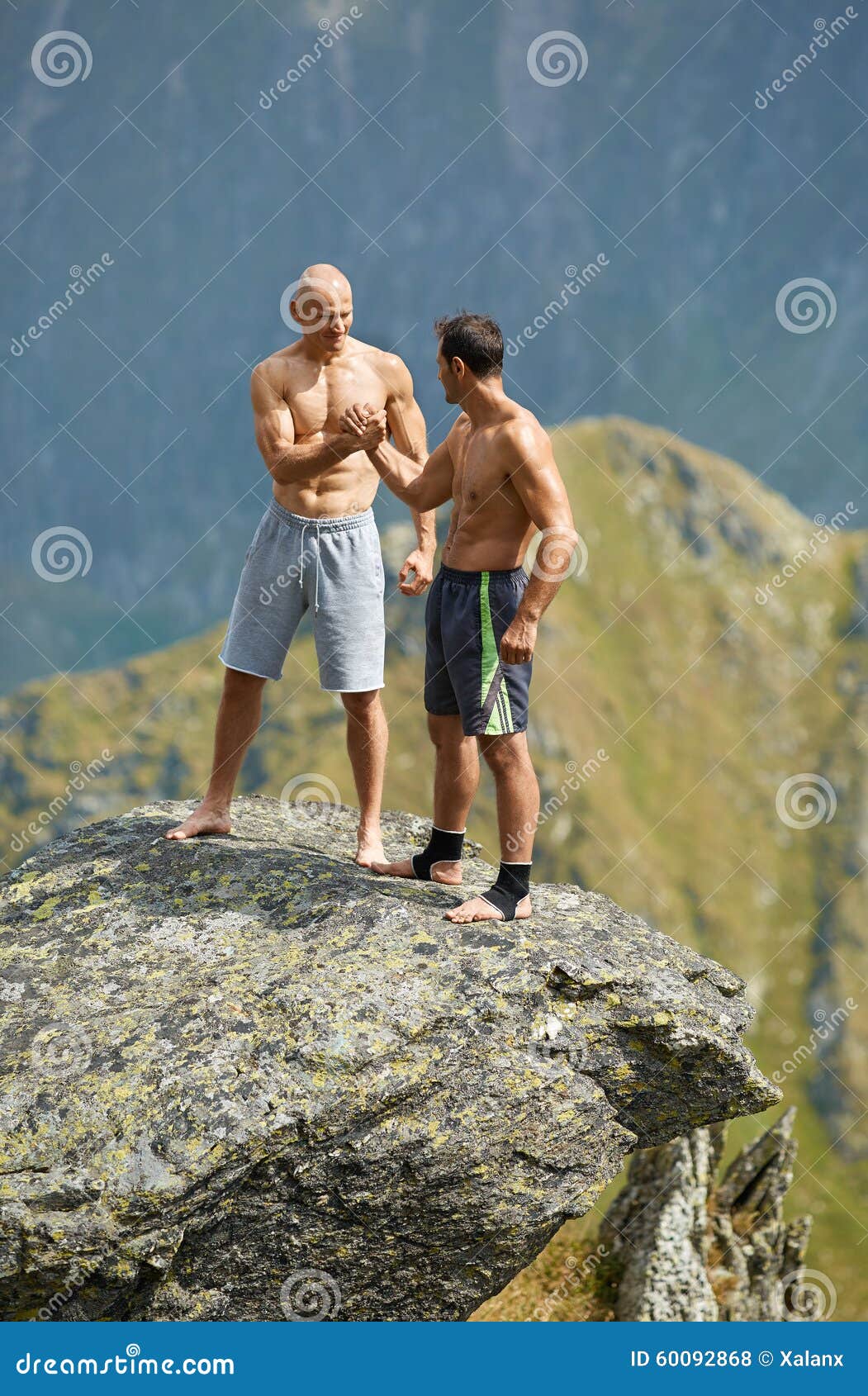 Kickboxers or Muay Thai Fighters Training on a Mountain Cliff Stock ...