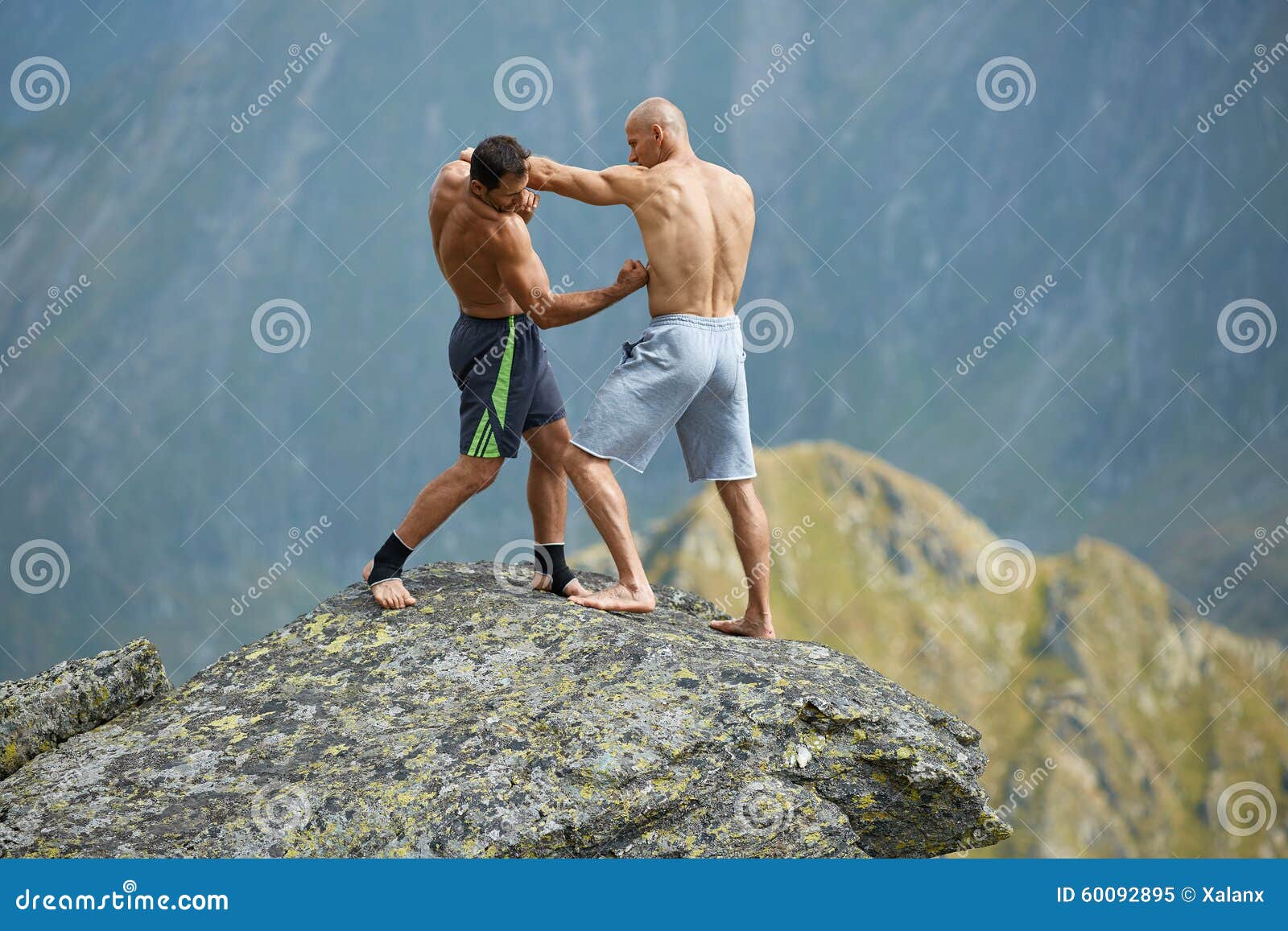 Kickboxers or Muay Thai Fighters Training on a Mountain Cliff Stock ...