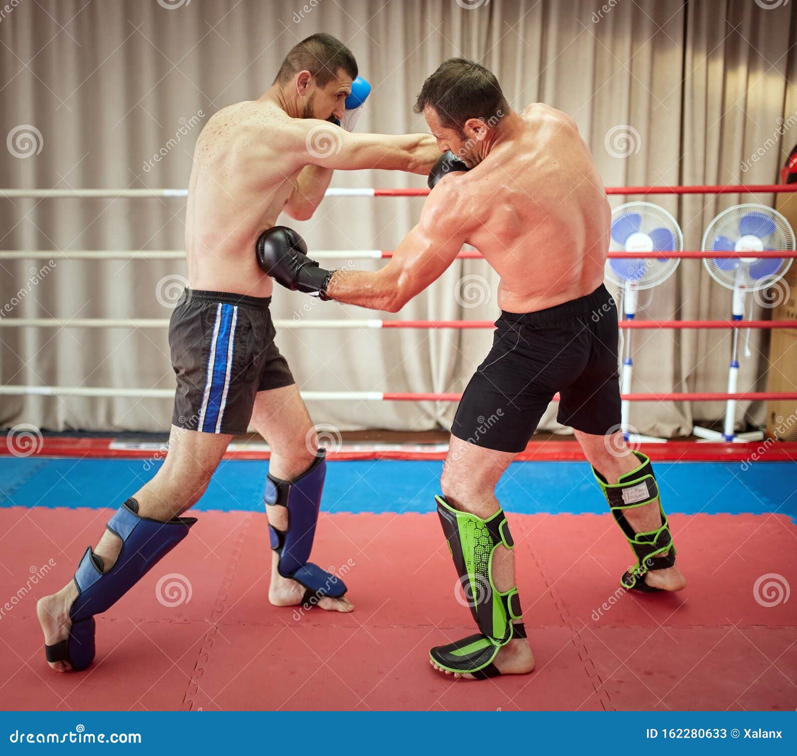 Kickboxers Sparring in the Ring Stock Image - Image of person, punch ...