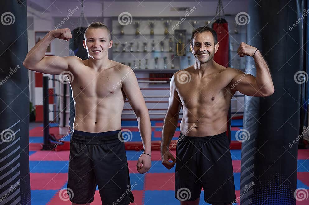 Kickboxing Coach and Student Posing in the Gym Stock Photo - Image of ...