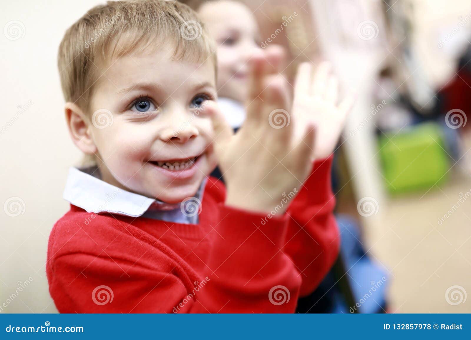 Kid applauds at concert stock photo. Image of activity - 132857978