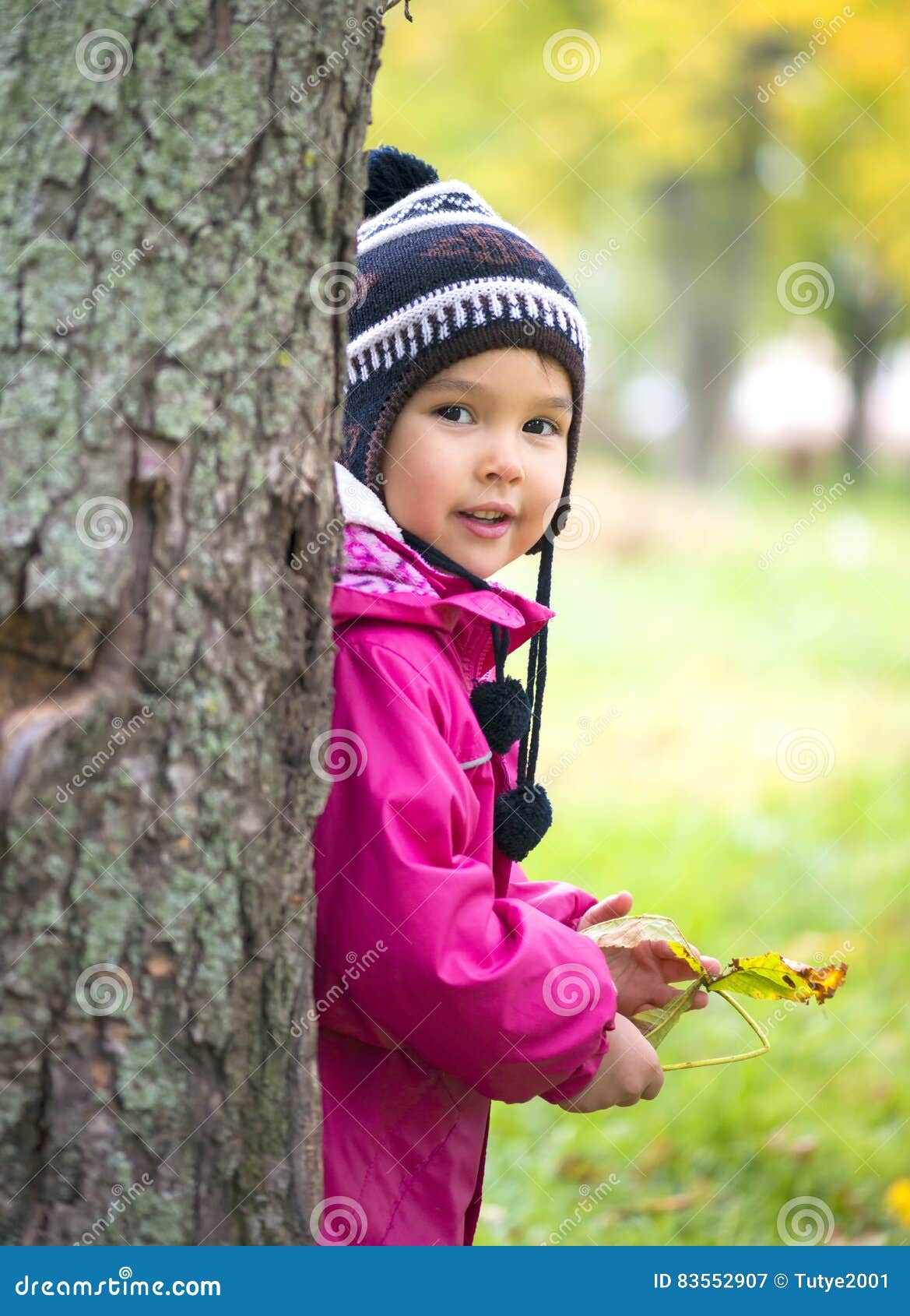 Kid in Autumn Park Hidden Behind Tree Stock Image - Image of hide ...
