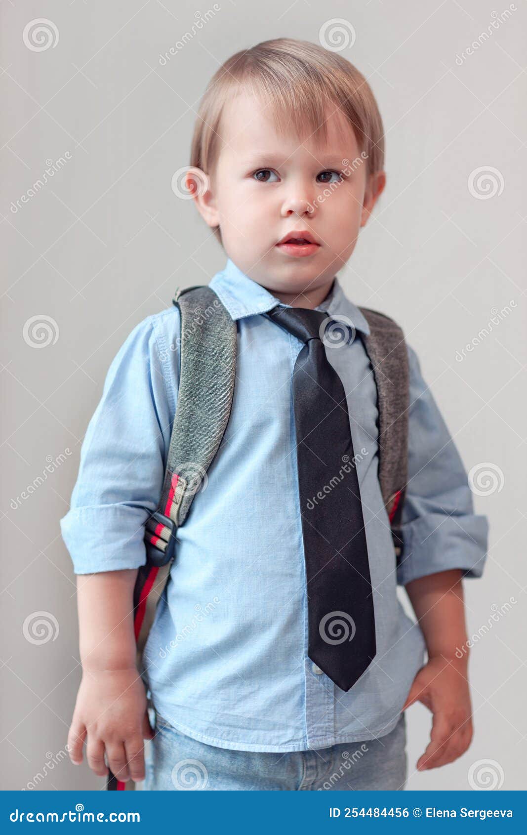 A Kid with a Backpack, a Child in a Shirt and Tie is Getting Ready for ...
