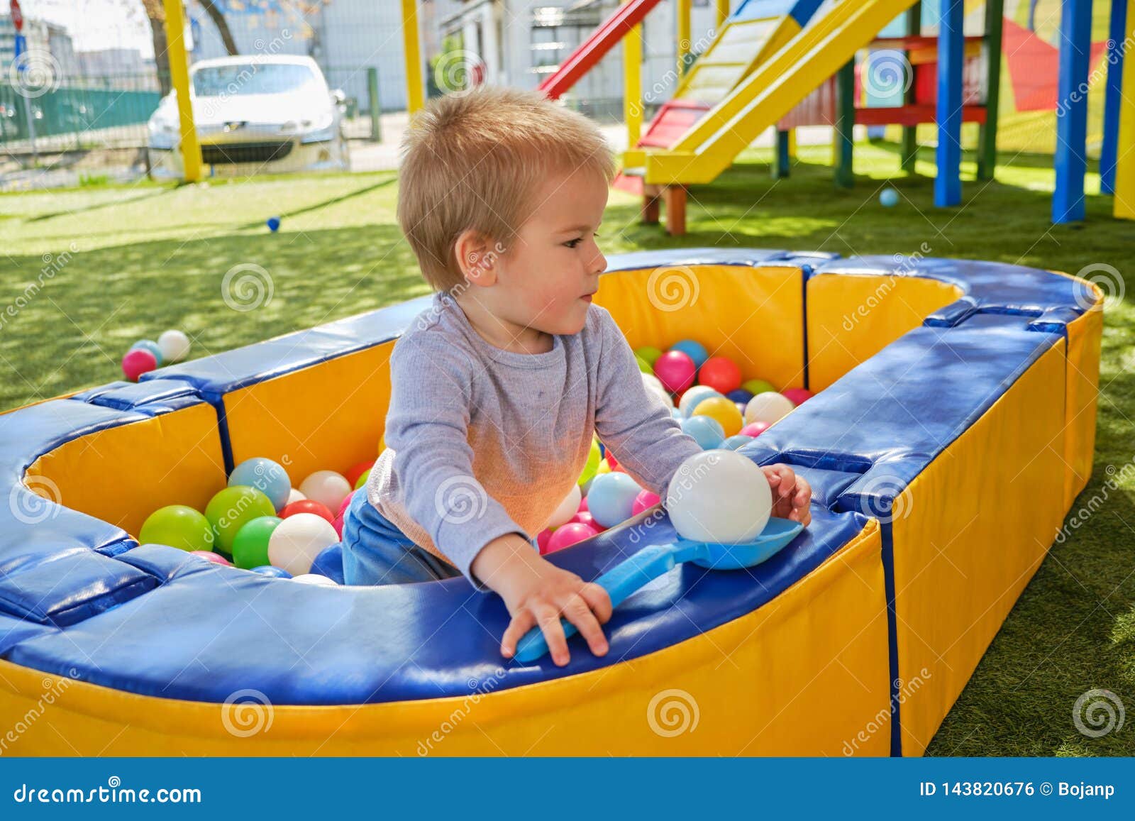 Kid in Ball Pit Having Fun in Children Play Center Stock Photo - Image ...