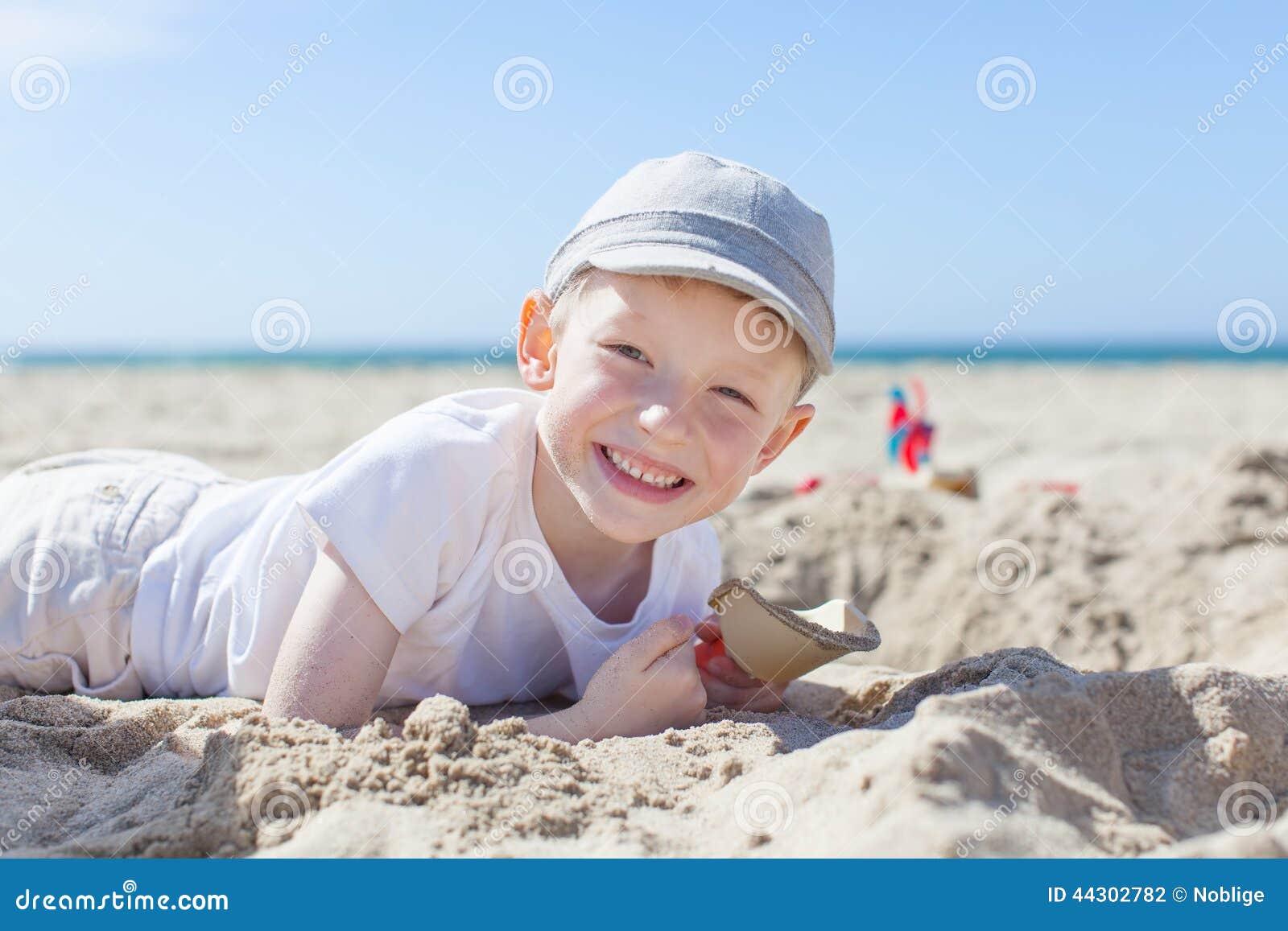Kid at the beach stock photo. Image of resort, sunhat - 44302782