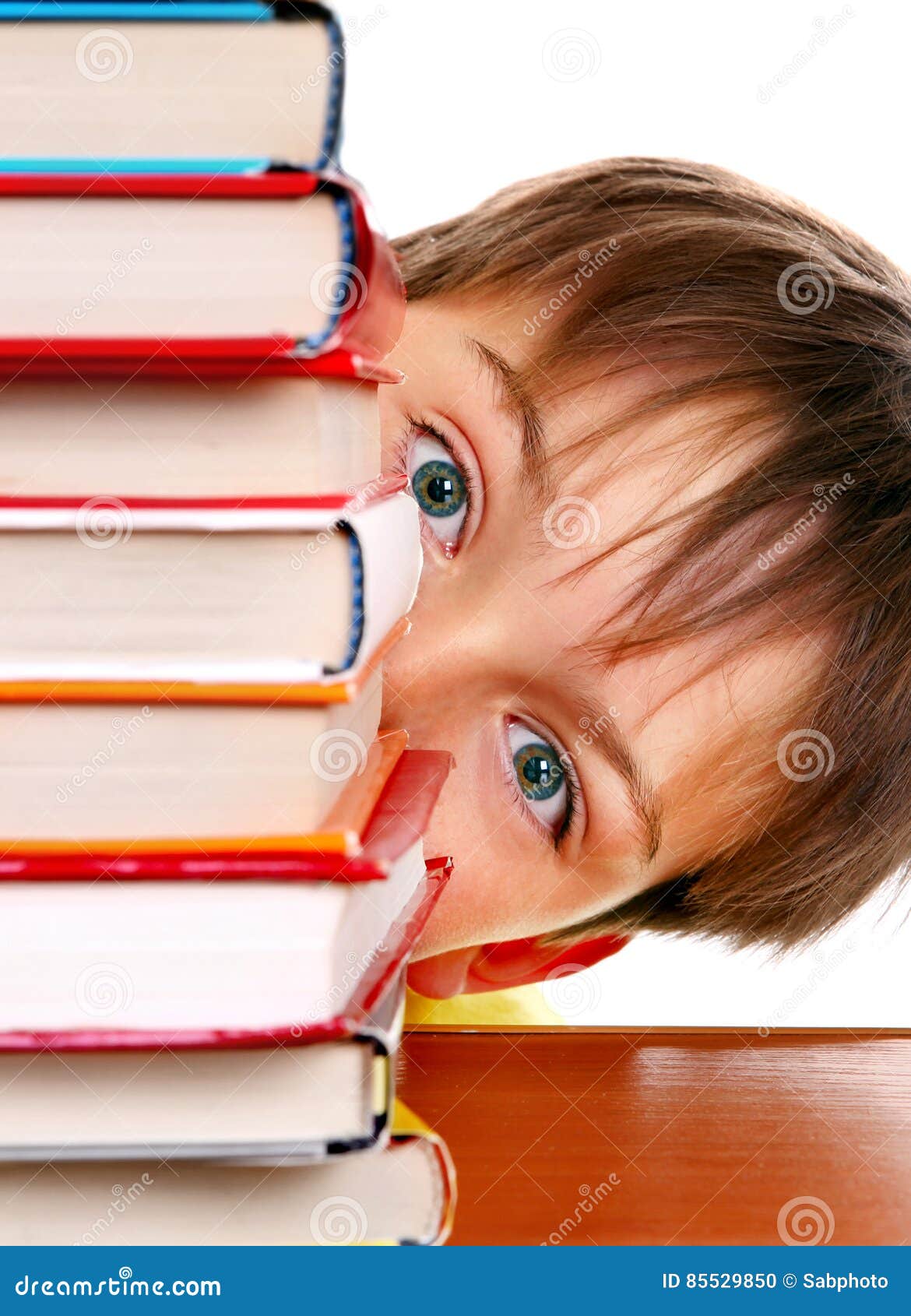 Kid behind the Books stock photo. Image of manuals, childhood - 85529850
