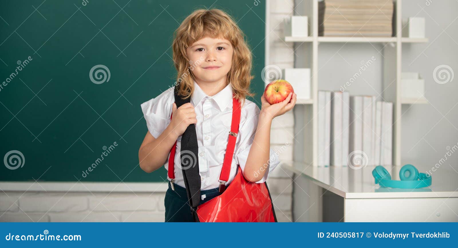 Kid Boy with Backpack and Apple at School. Elementary School Child in ...