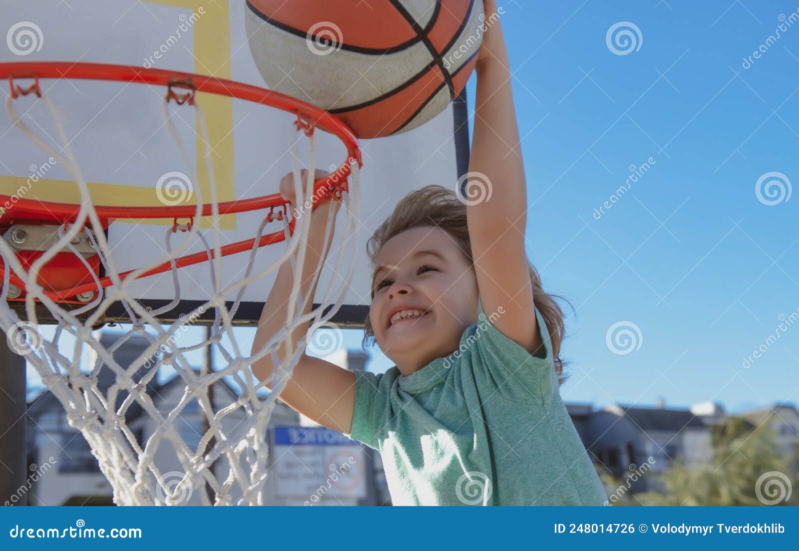 Kid Boy Basketball Player with a Ball Scoring a Goal. Child Player ... Kid Boy Basketball Player with a Ball Scoring a Goal. Child Player ...