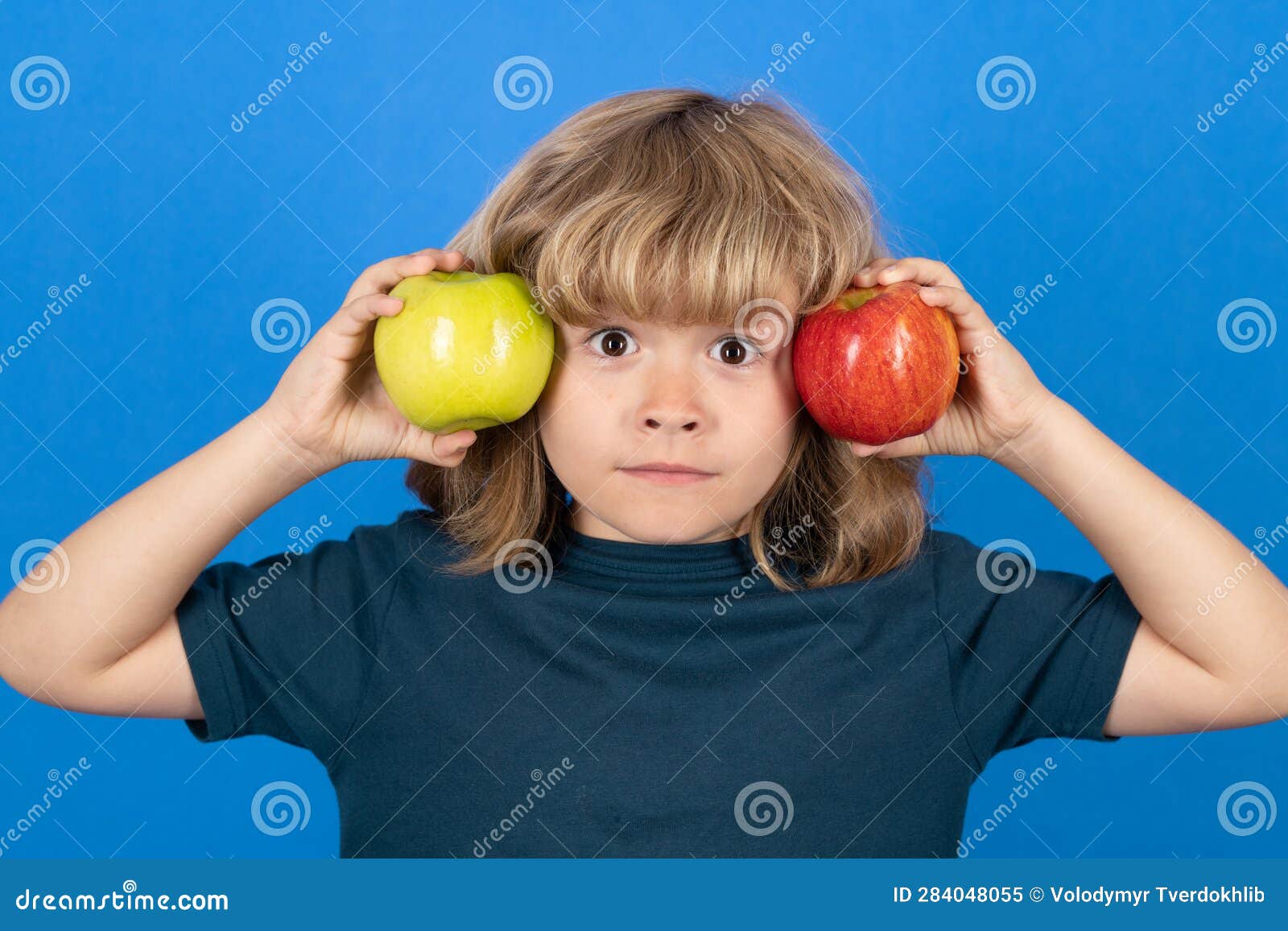 Kid Boy Choosing between a Red Apple and a Green Apple. Isolated on ...