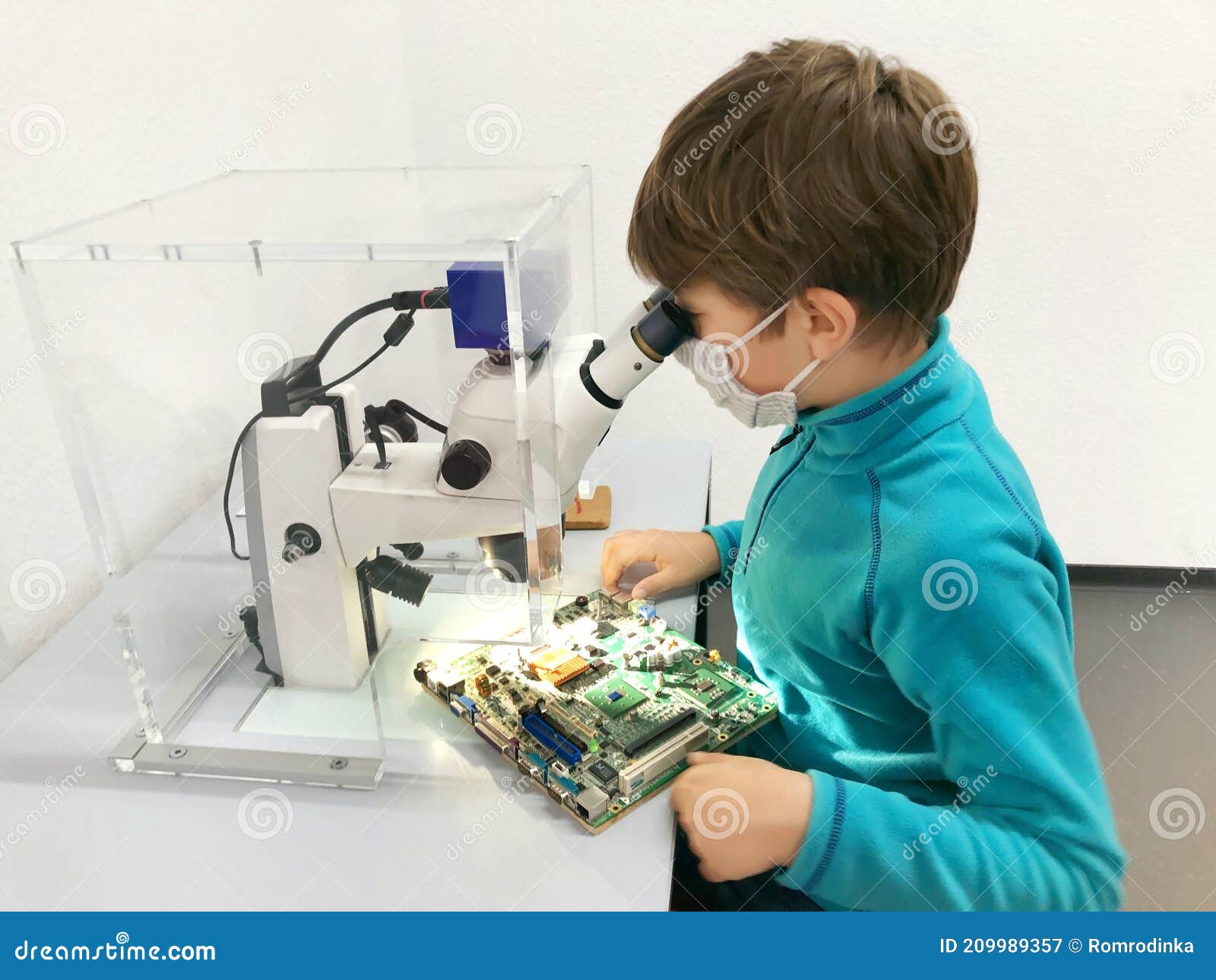 Kid Boy Conducts Experiment With Microscope In School Lab. Curious ...