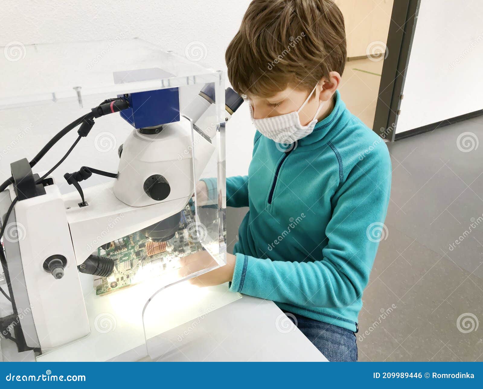 Kid Boy Conducts Experiment with Microscope in School Lab. Curious ...