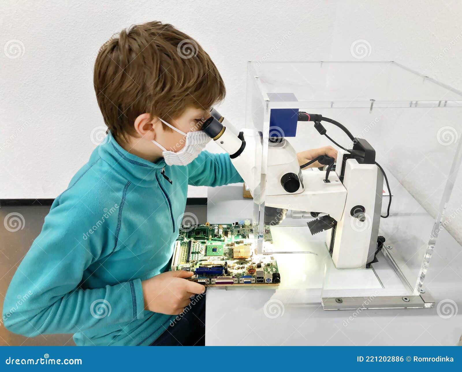 Kid Boy Conducts Experiment with Microscope in School Lab. Curious ...
