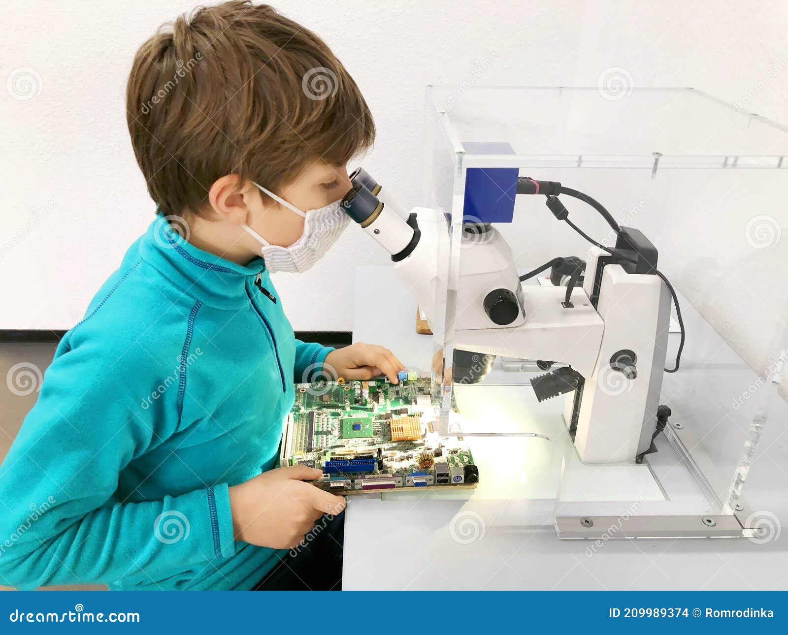 Kid Boy Conducts Experiment with Microscope in School Lab. Curious ...