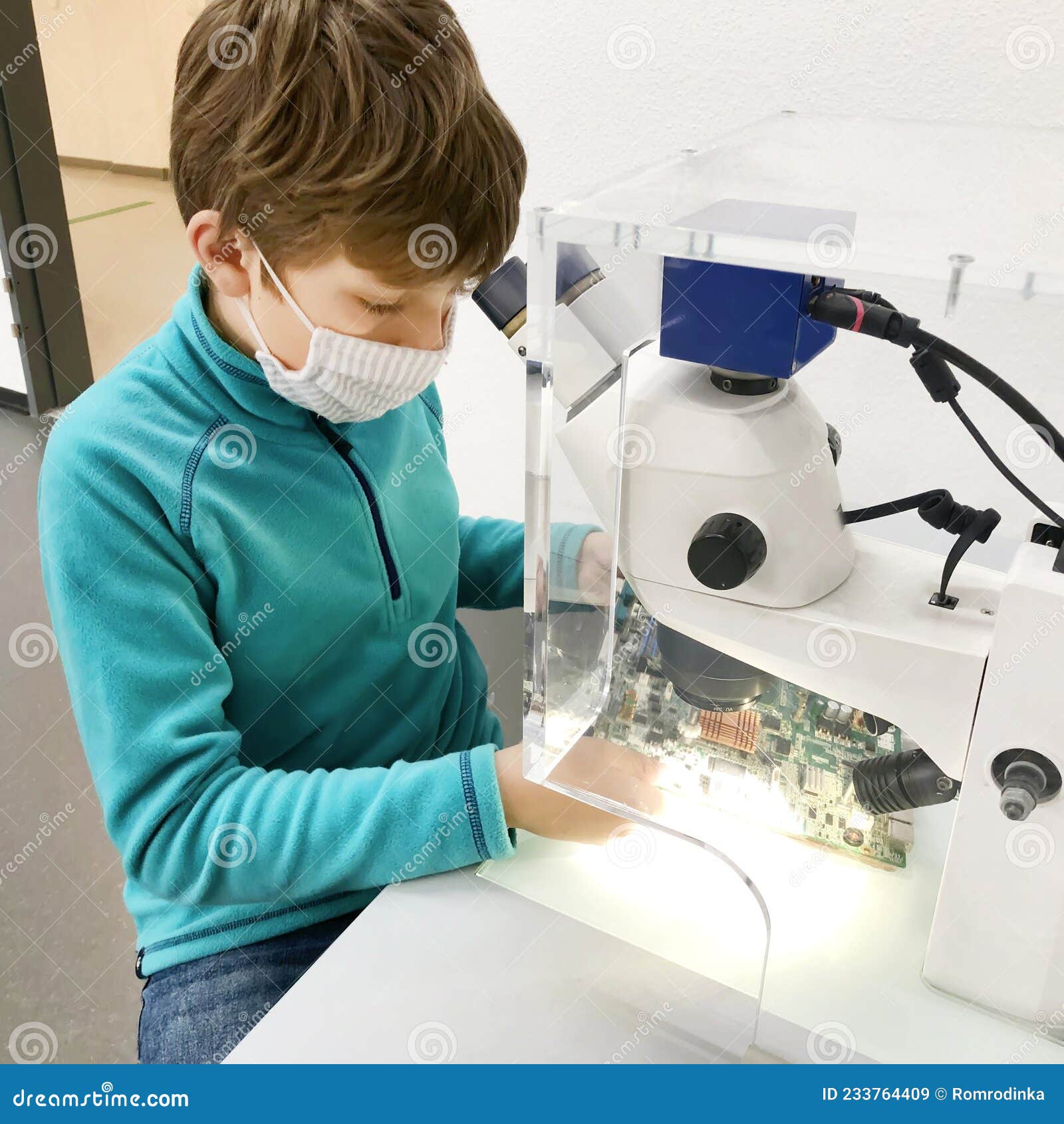 Kid Boy Conducts Experiment with Microscope in School Lab. Curious ...