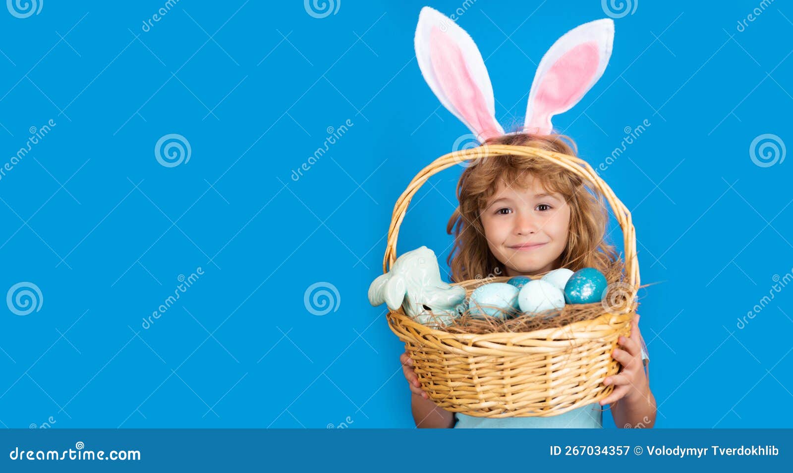 Kid Boy with Easter Basket Isolated on Blue Background. Happy Easter ...