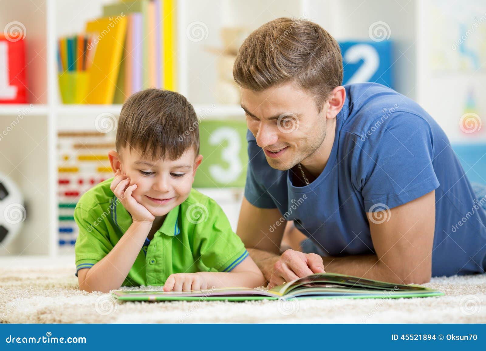 Kid Boy and Father Read a Book on Floor Indoors Stock Photo - Image of ...