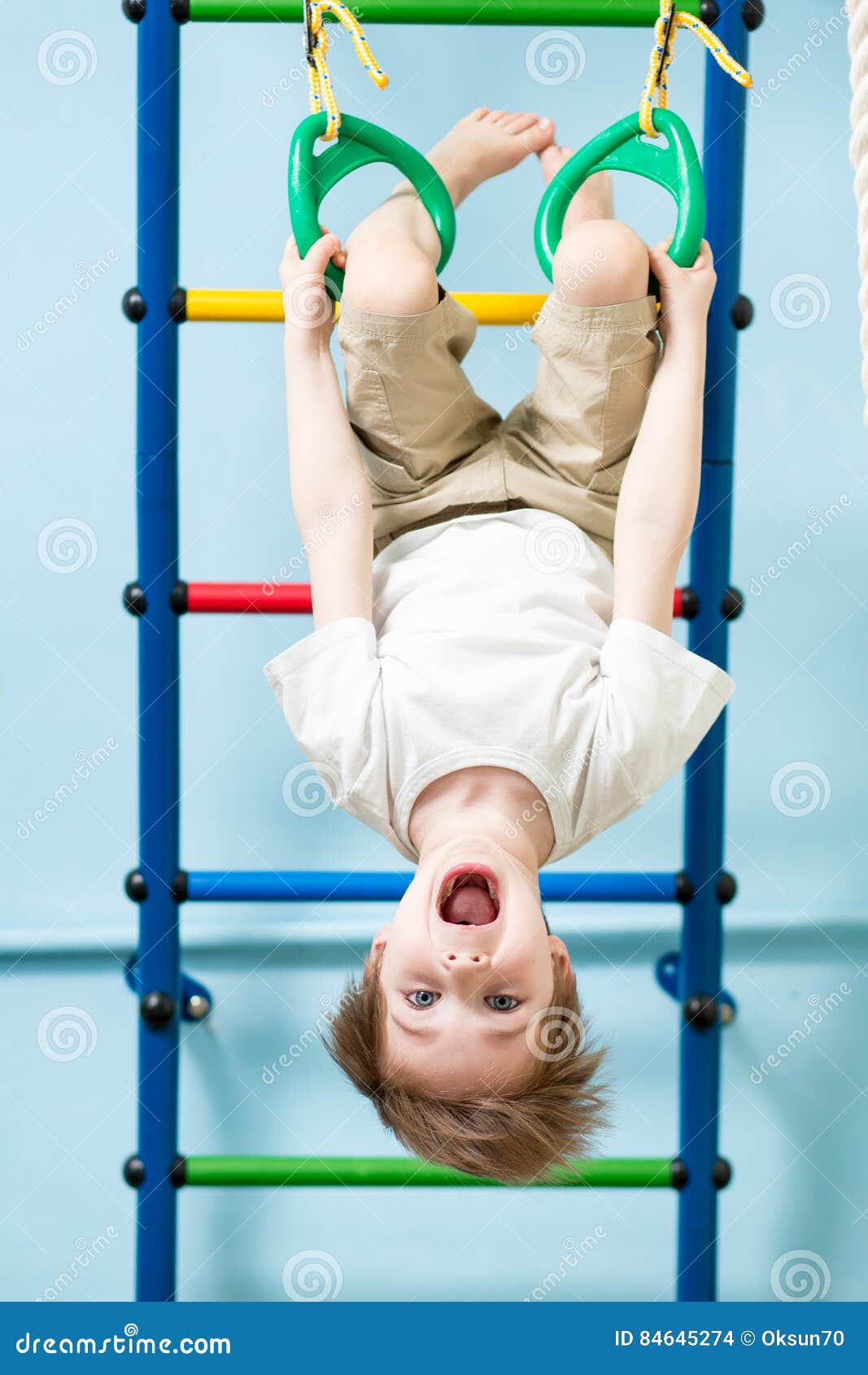 Kid Boy on the Gymnastic Rings in the Gym Class Stock Photo - Image of ...
