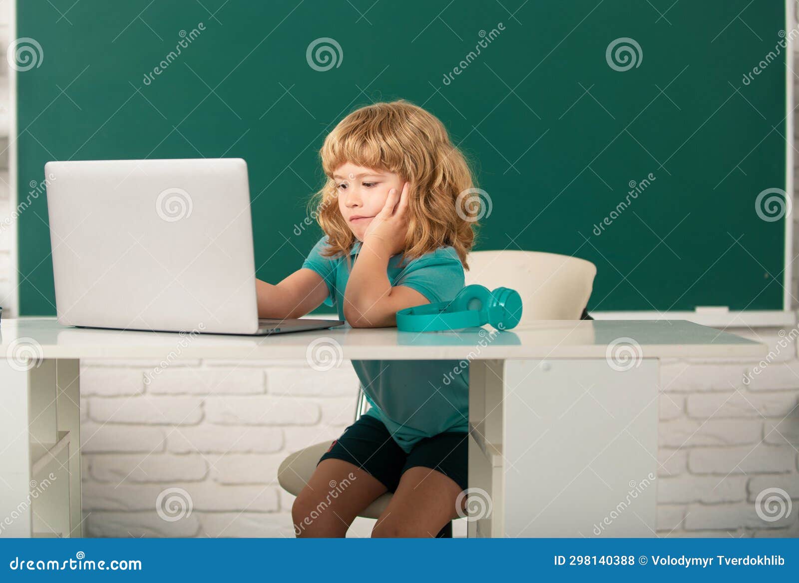 Kid Boy Learning Lesson at School, Making Homework and Using Notebook ...