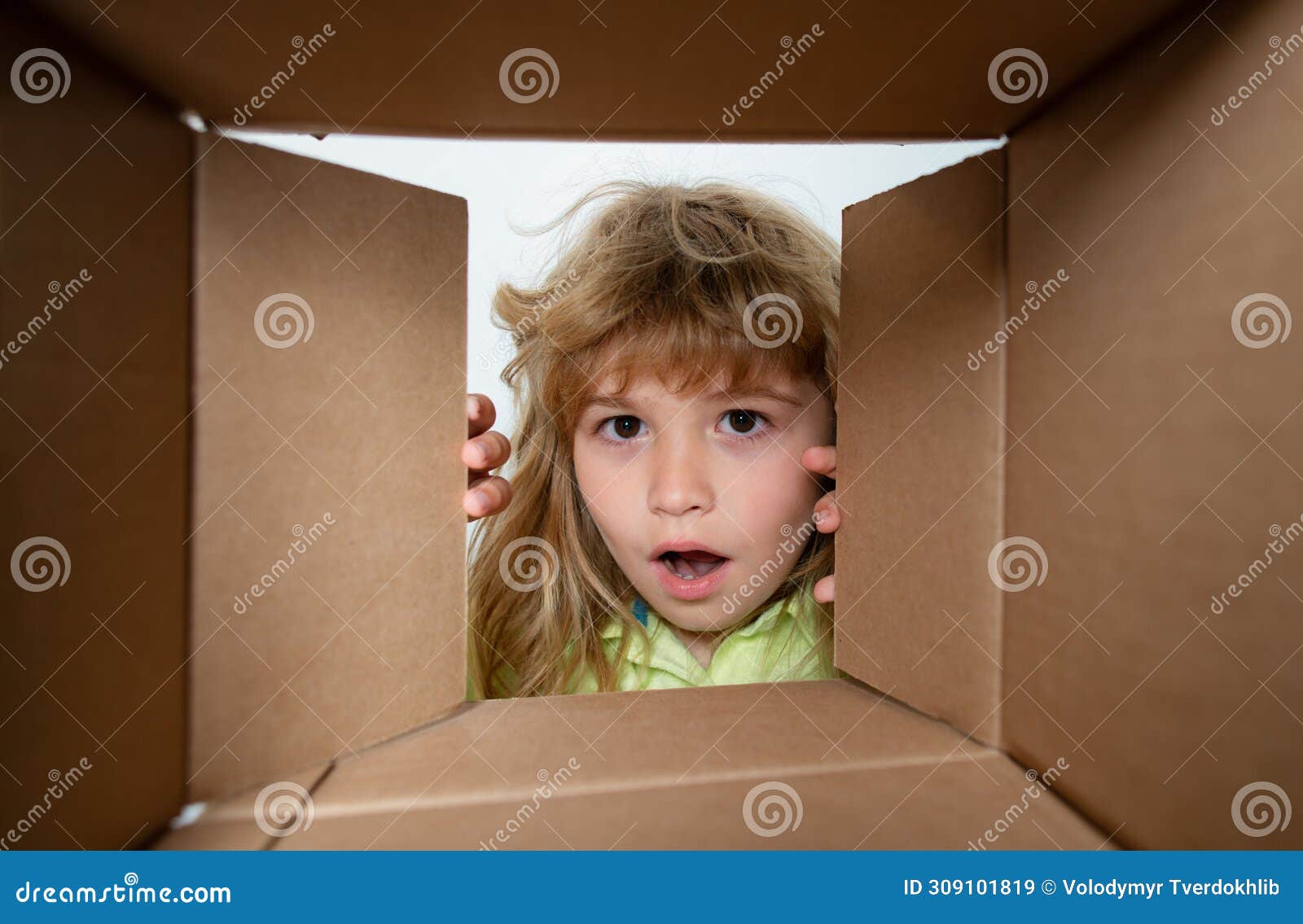 Kid Boy Unpacking and Opening Carton Box Looking Inside with Surprise ...