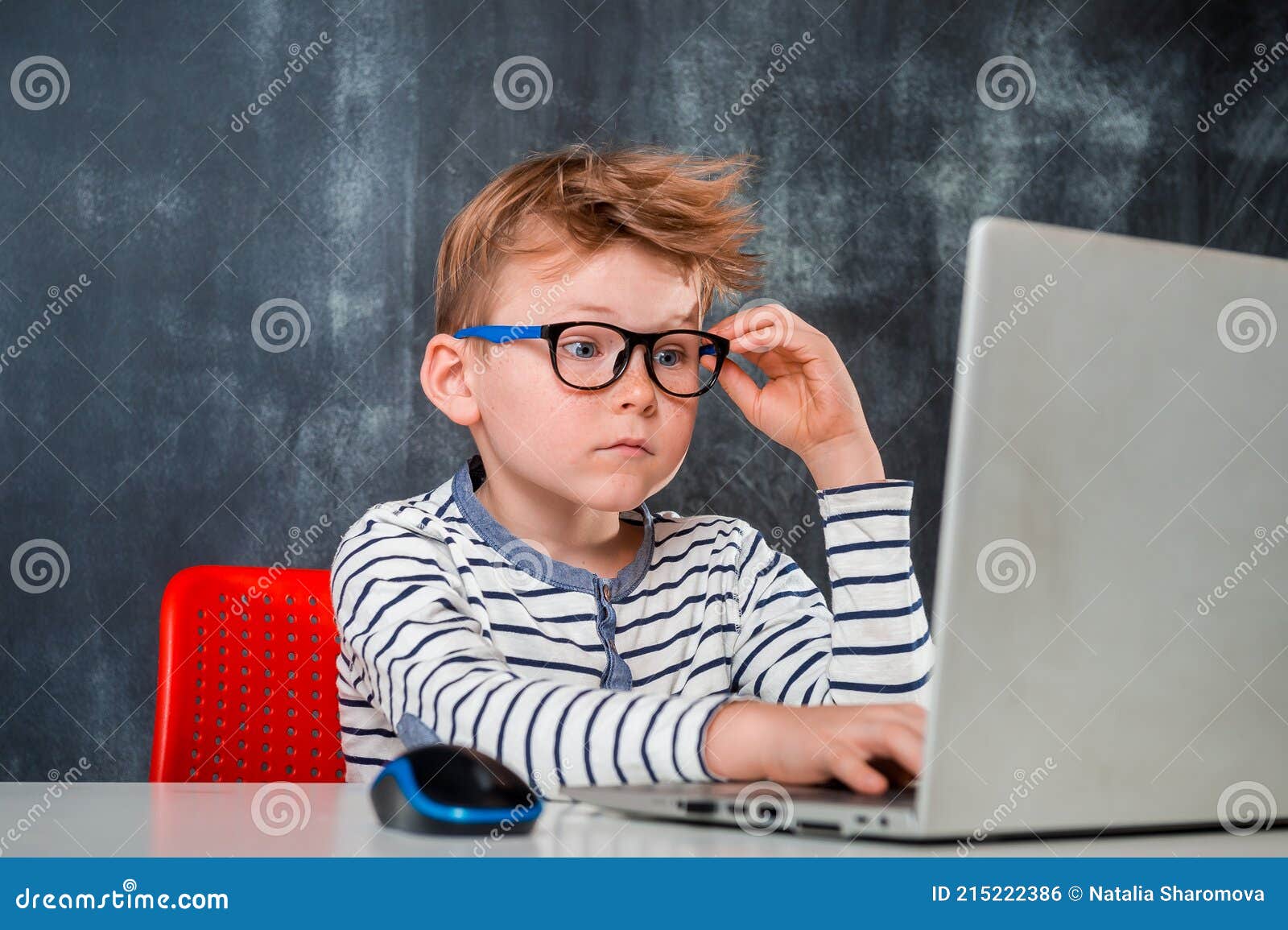 Kid Boy Using Laptop Computer at His Online Lesson at School Stock ...